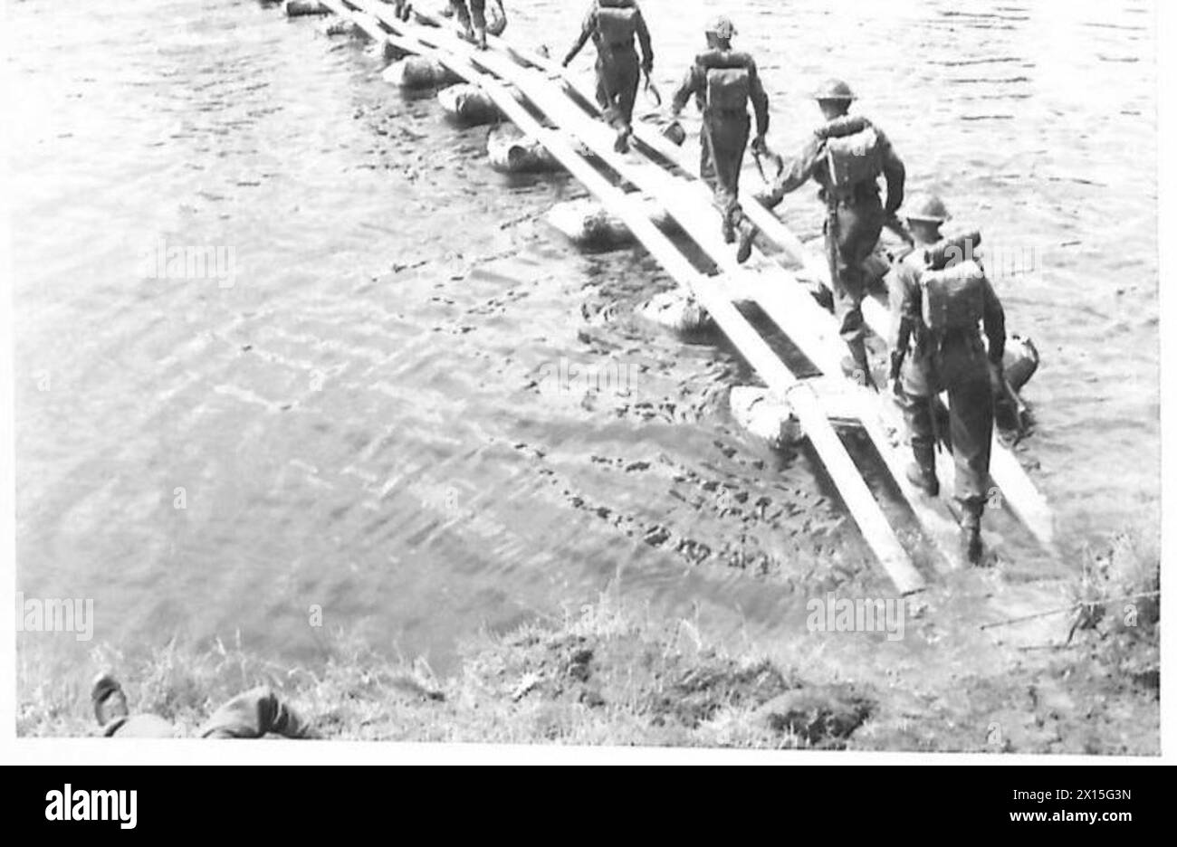 NORWEGIAN TROOPS IN SCOTLAND - Infantry crossing a temporart bridge ...