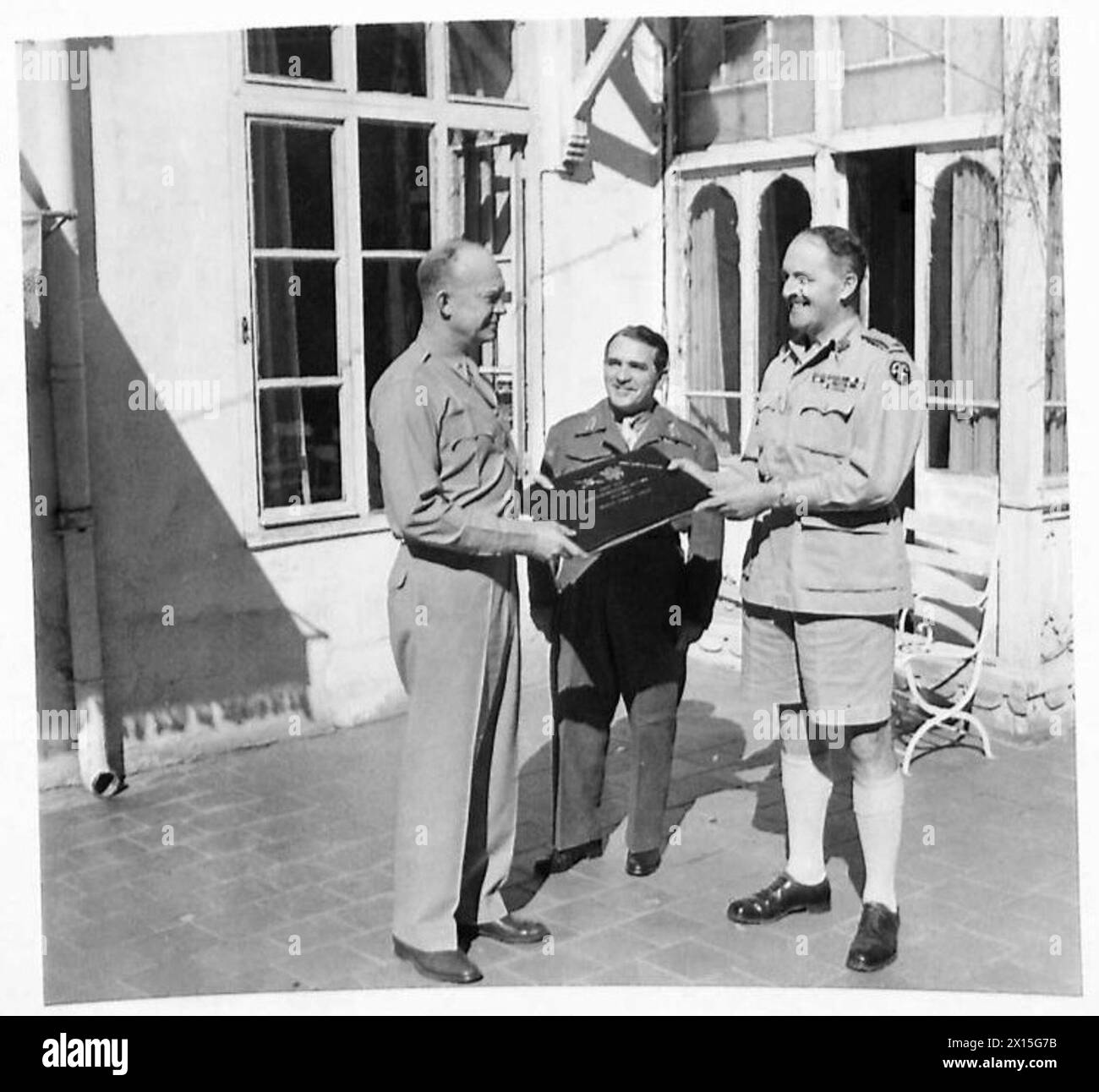 PRESENTATION TO THE ALLIED C-IN-C - General Eisenhower receiving from ...