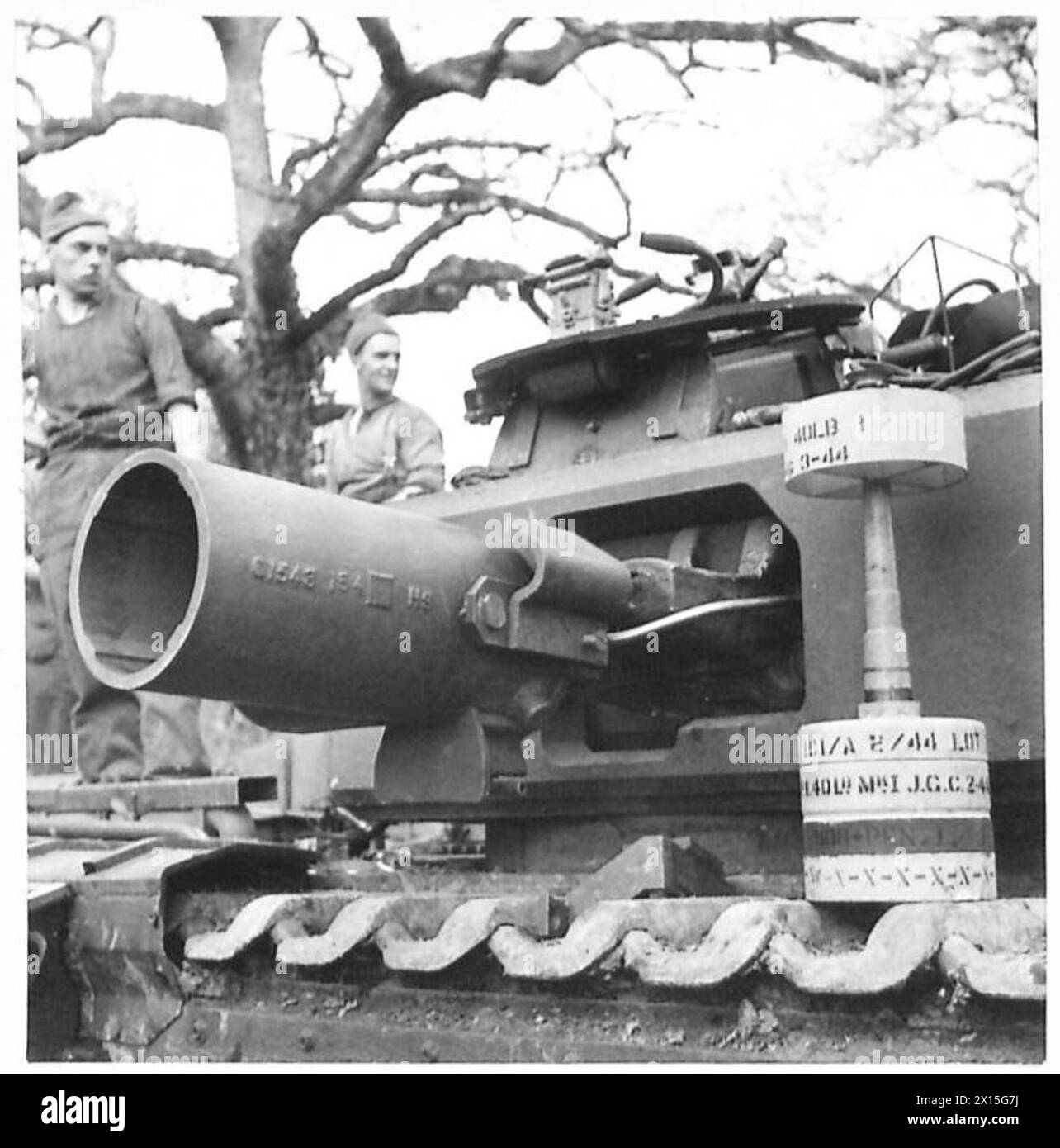 An AVRE Churchill tank equipped with a Petard spigot fires a 40-pound ...