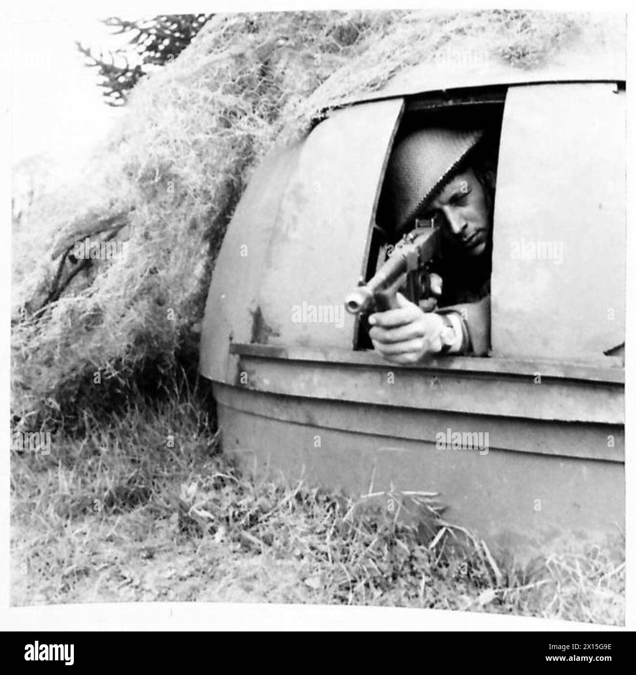 A SOUTHERN EXERCISE - A Tommy gunner in a metal cupola keeps a close ...