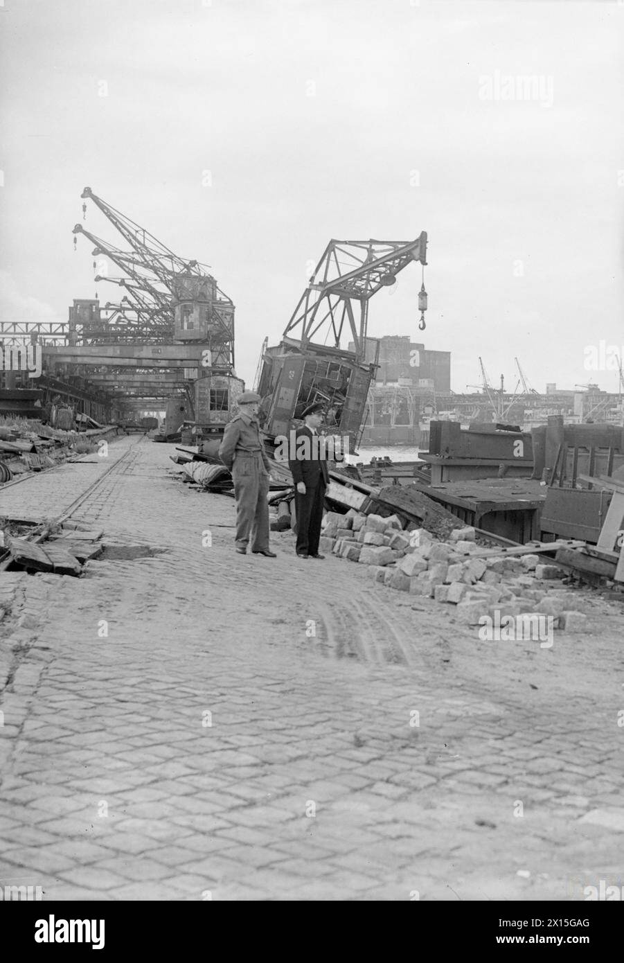 WRECKAGE IN THE BOMB-SCARRED HAMBURG DOCKS. 8 JULY 1945, WRECKED AND ...