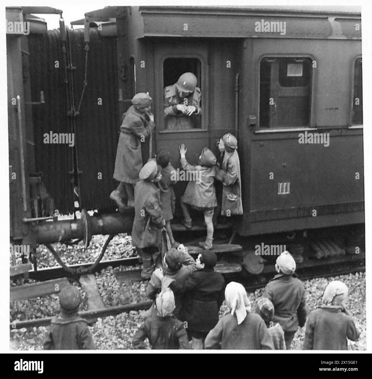 Italian children sing to an American officer aboard the Fifth Army hospital train in Italy ...