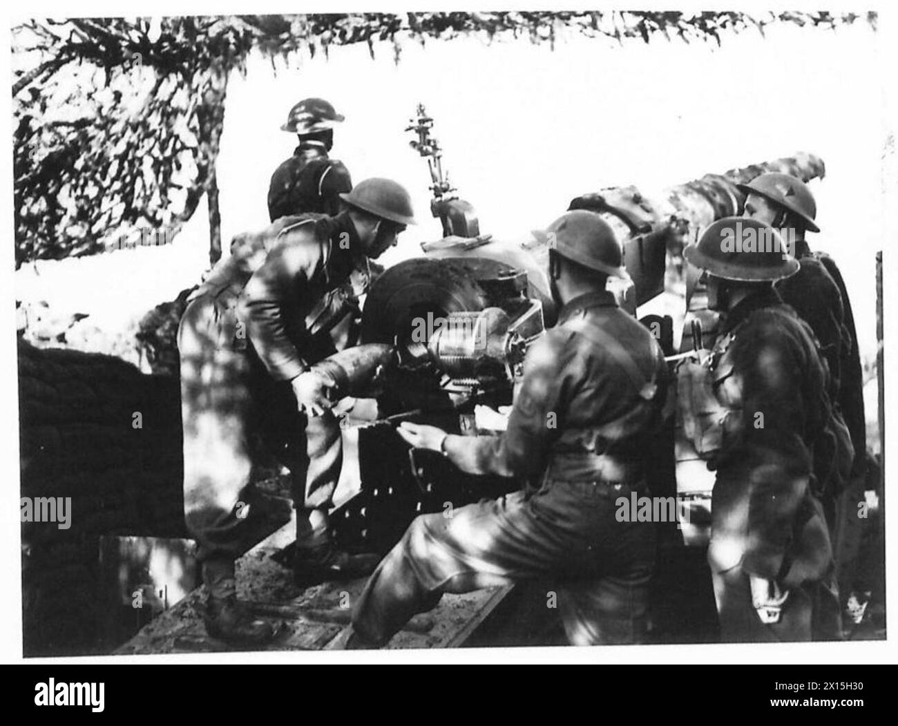 GUNNERY PRACTICE IN SCOTLAND - Loading a shell into the breech ...
