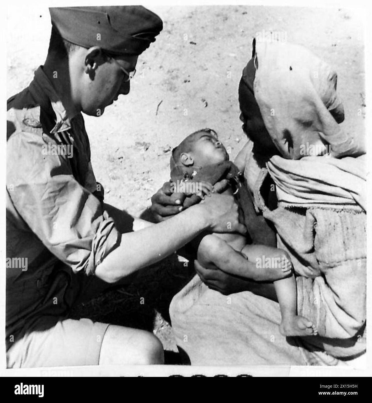 Major A.B. White of the British Army hygiene section examines an Arab ...