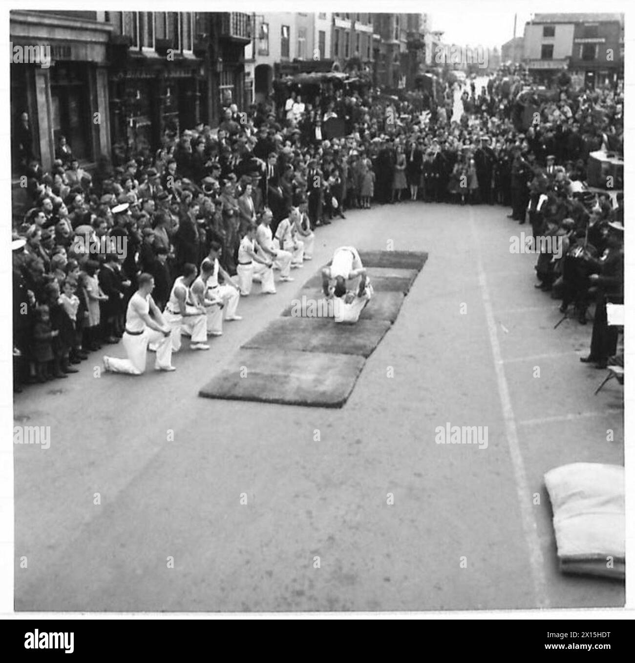 MILITARY DISPLAY FOR WORKERS - Crowds watch the physical training team ...