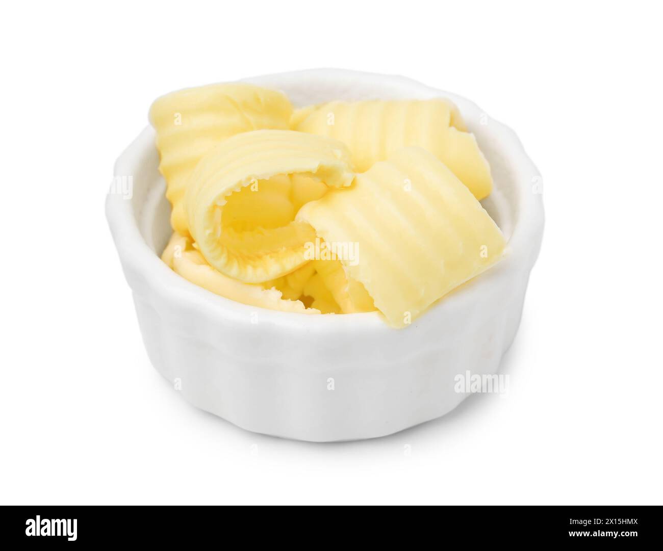 Tasty butter curls in bowl isolated on white Stock Photo - Alamy