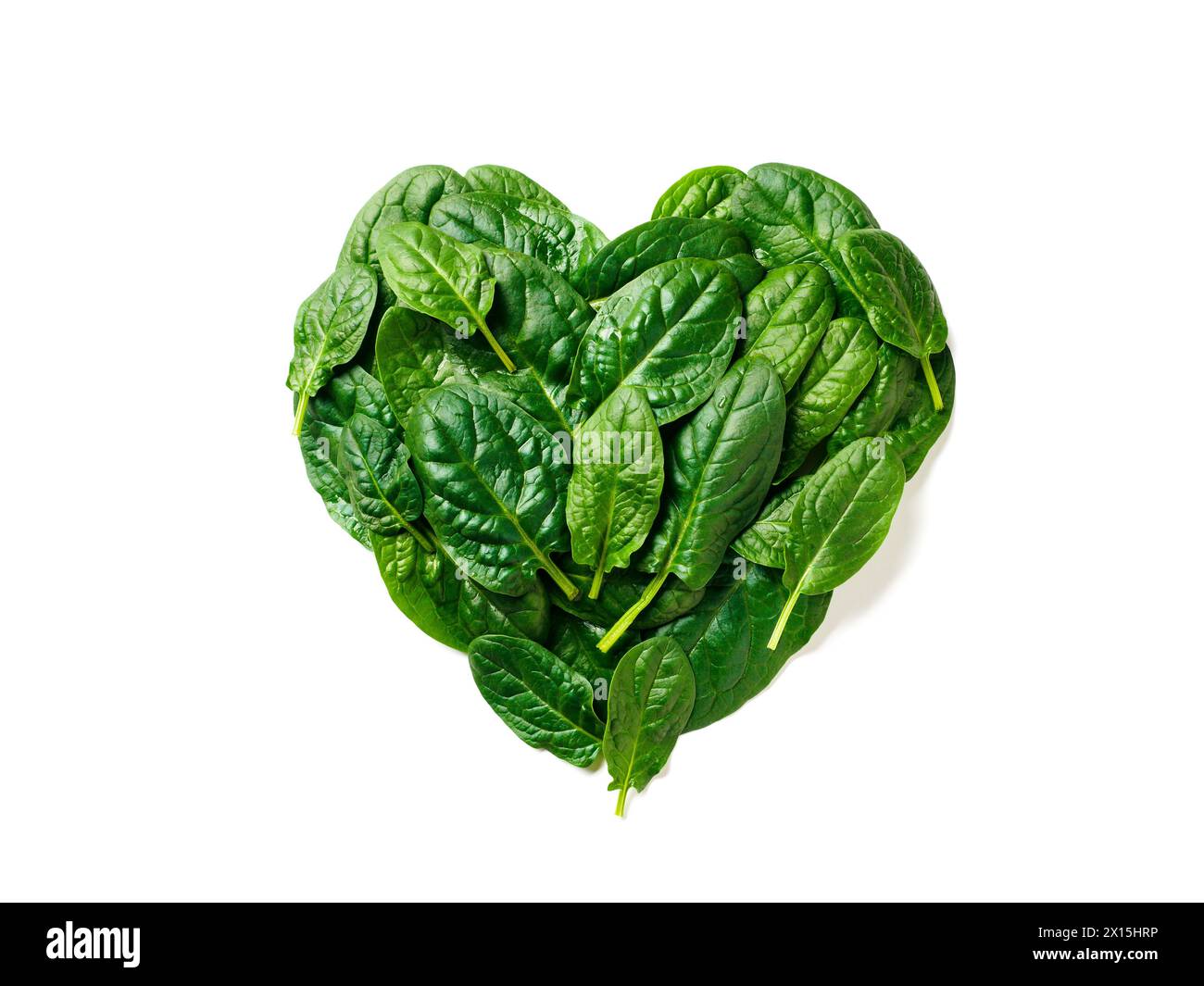 Heart shape made from spinach leaves. Spinach pattern isolated on white ...
