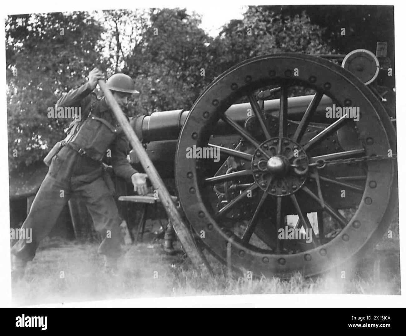 SPEEDING UP THE ARTILLERY - Levering the gun into position with a ...