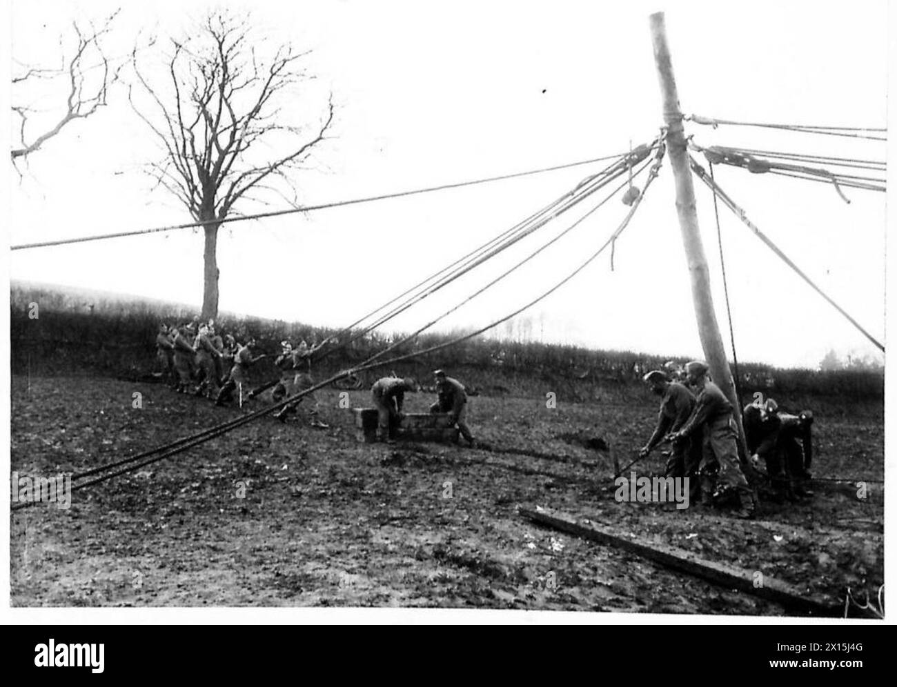 COLONIAL TROOPS IN THIS COUNTRY - Hauling ropes to pull girder section ...