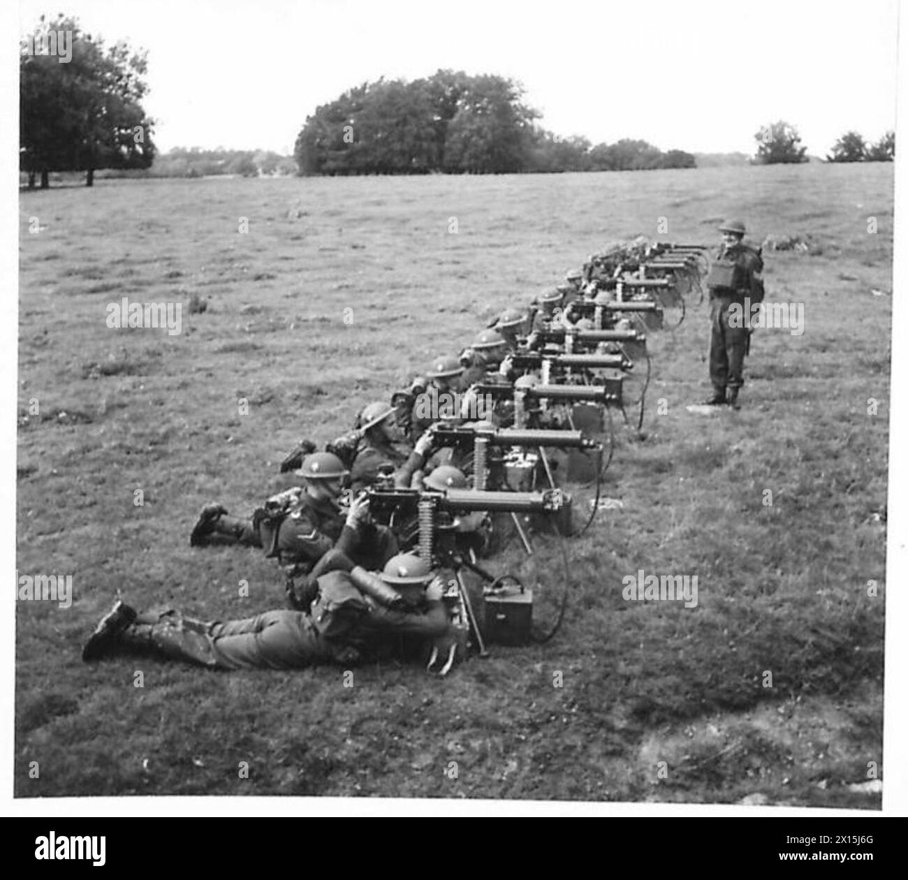 A MACHINE GUN BATTALION IN TRAINING - A line of machine-gunners ready ...