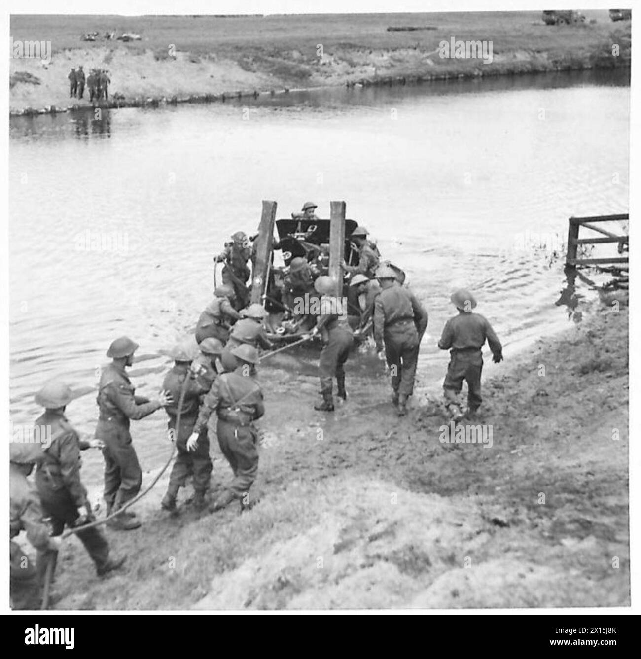 GETTING ACROSS RIVERS - A two pounder anti-tank gun is ferried across a ...