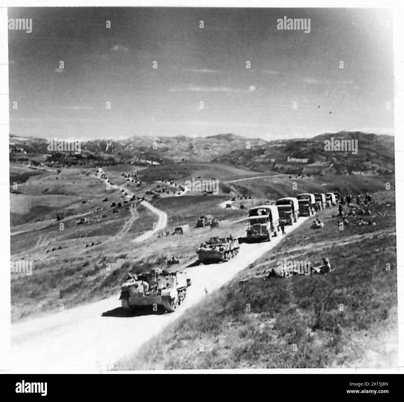 EIGHTH ARMY : VARIOUS - Long columns of vehicles wind over the hills of ...