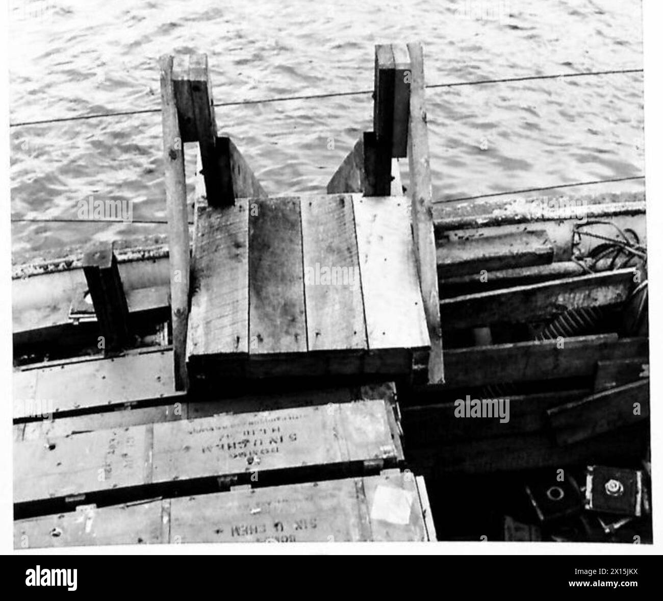 An L.C.T. fitted with wooden side chutes is used by British Army ...