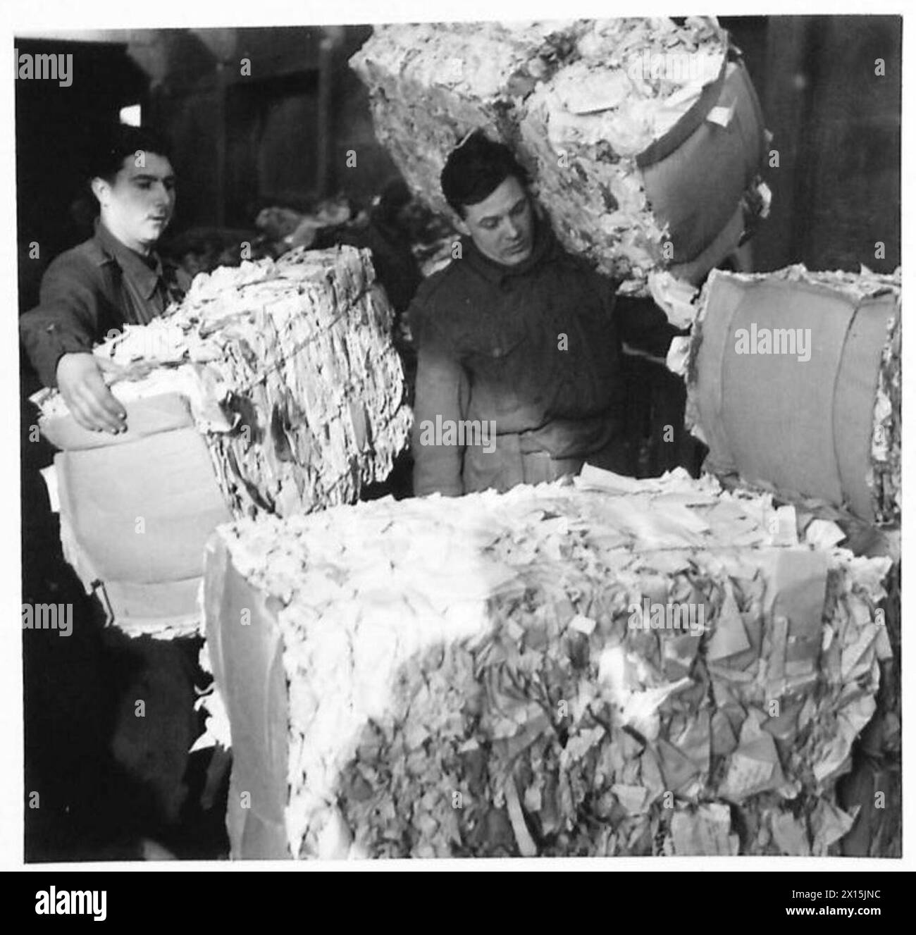 ARMY SALVAGE - Bales of waste paper ready for removal to the mills for ...