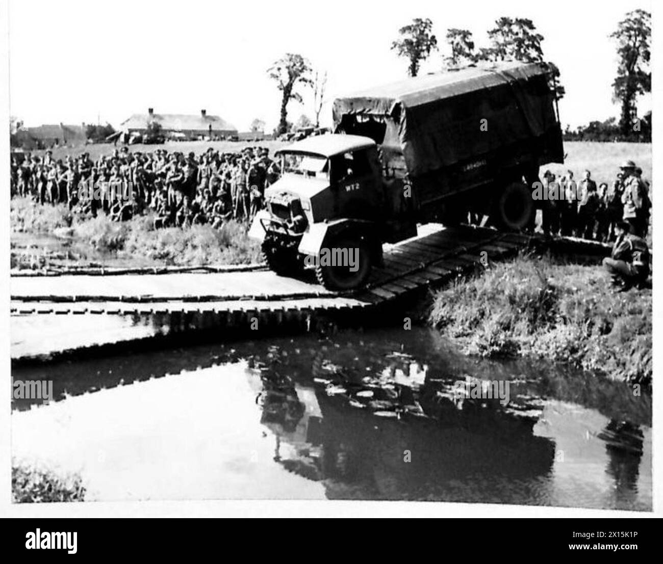 A 3-ton lorry carrying anti-tank equipment crosses a Class 9 bridge as ...