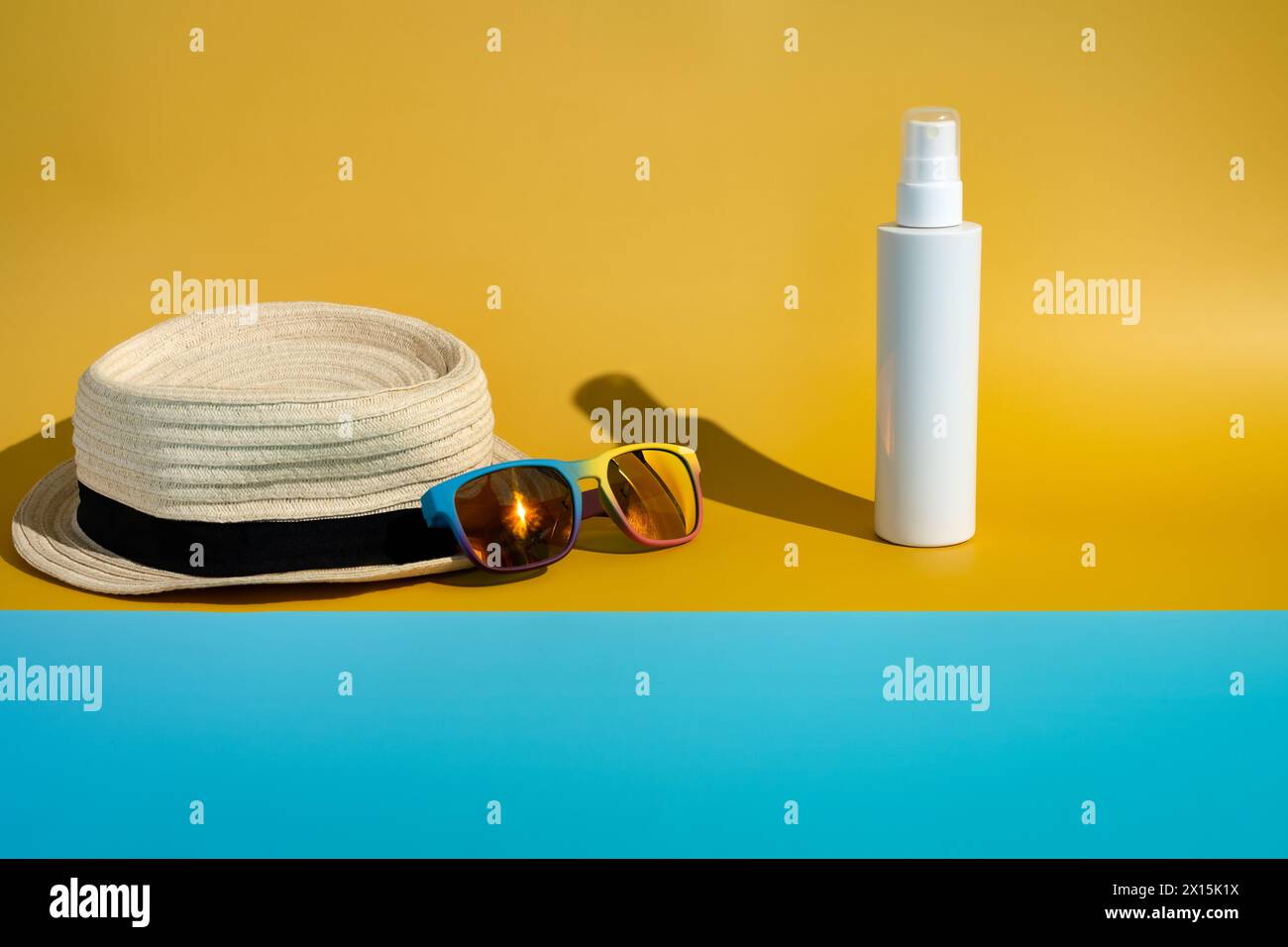 blank sunscreen packaging bottle sun hat and sunglasses on minimalist ...
