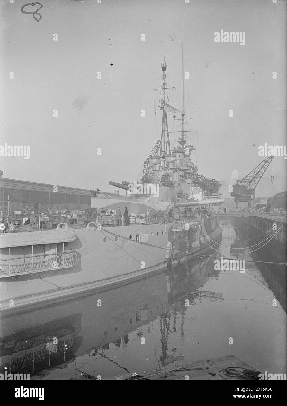 In 1940 at Rosyth, HMS Queen Elizabeth is in dry dock undergoing final ...