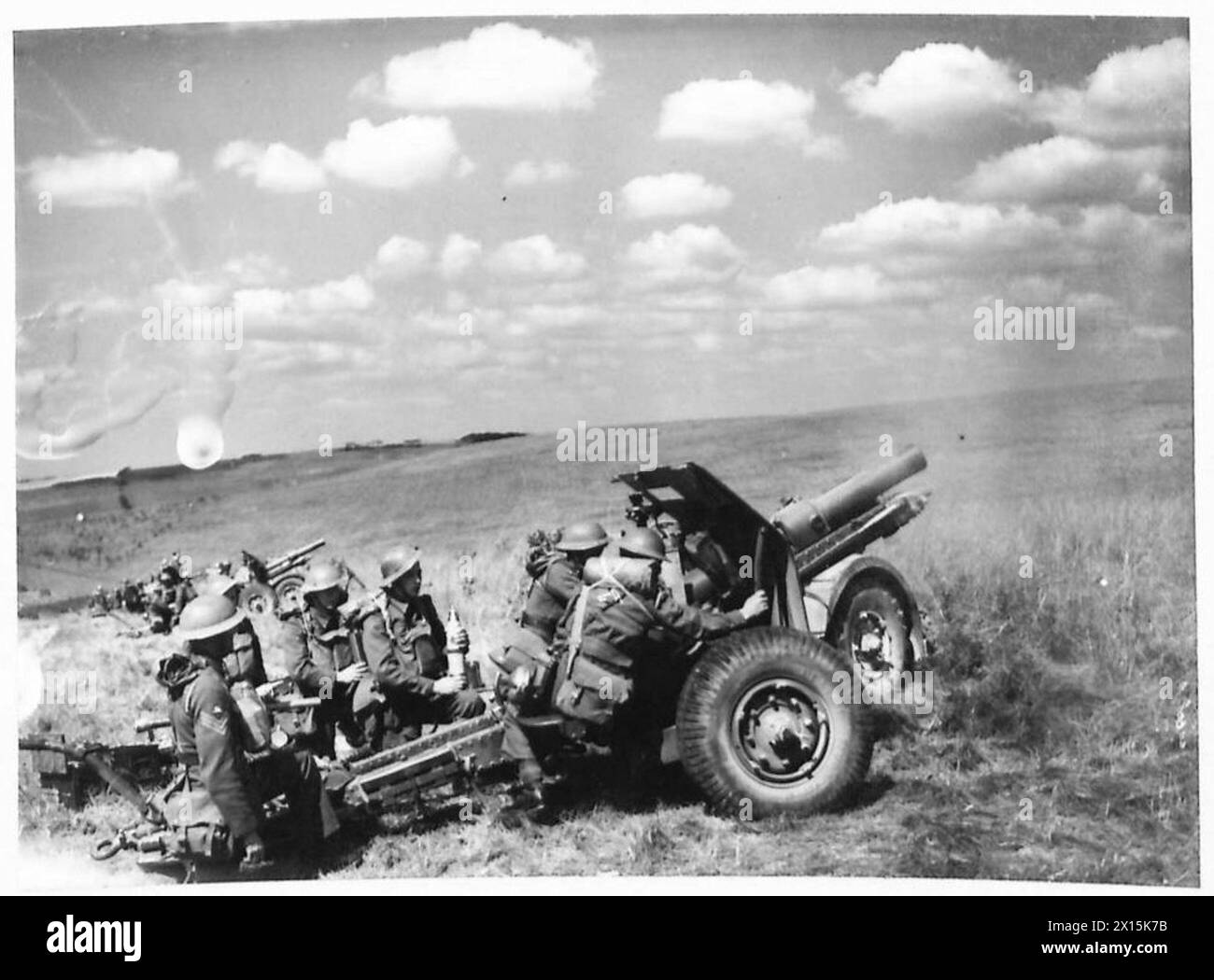 A FIELD REGIMENT IN TRAINING - Firing one of the Battery's 25 pounder ...