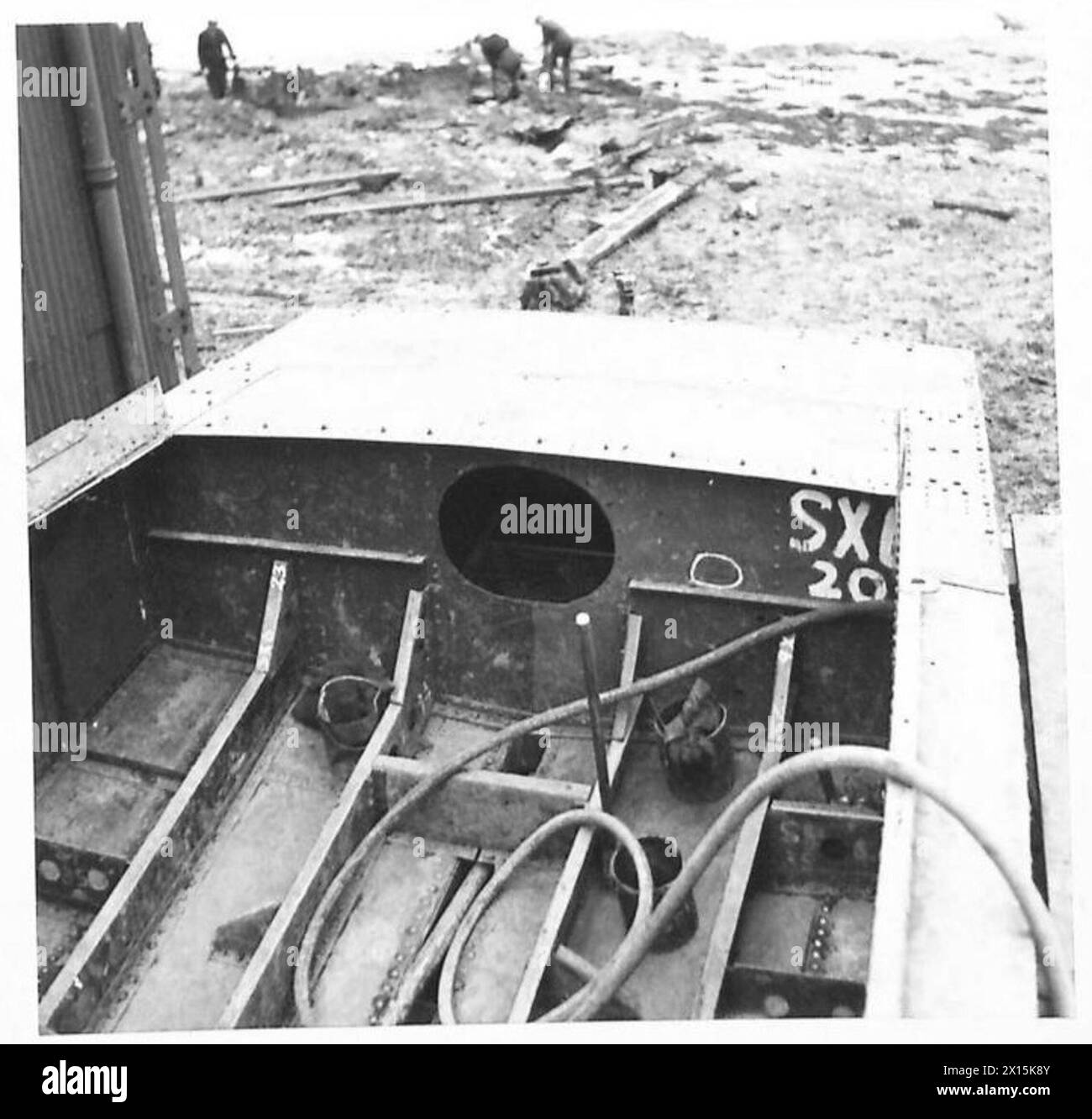 The Royal Engineers assemble a single screw motor launch, showing the ...