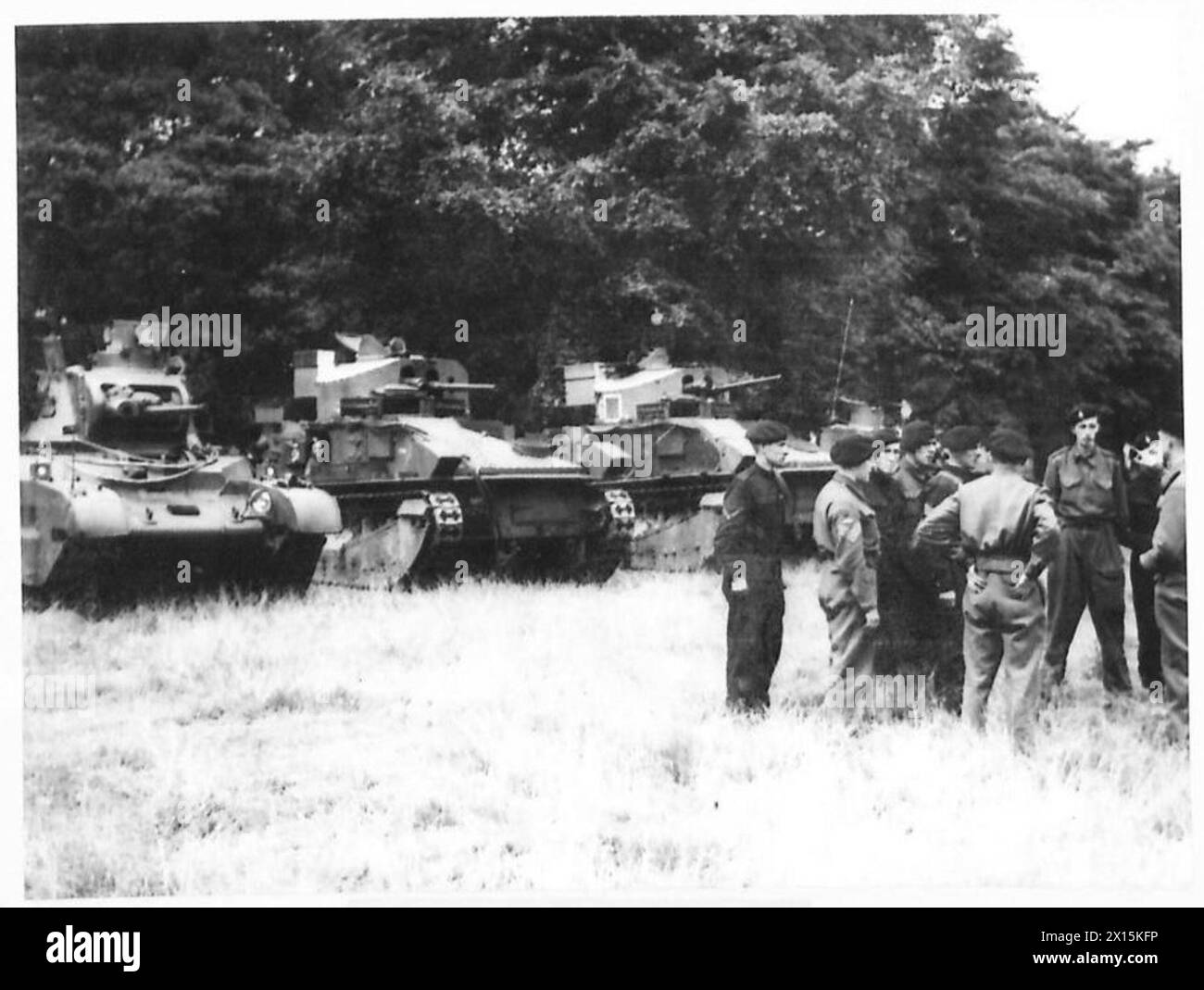 THE ROYAL TANK REGIMENT PREPARES - Assembled at the edge of a wood ...