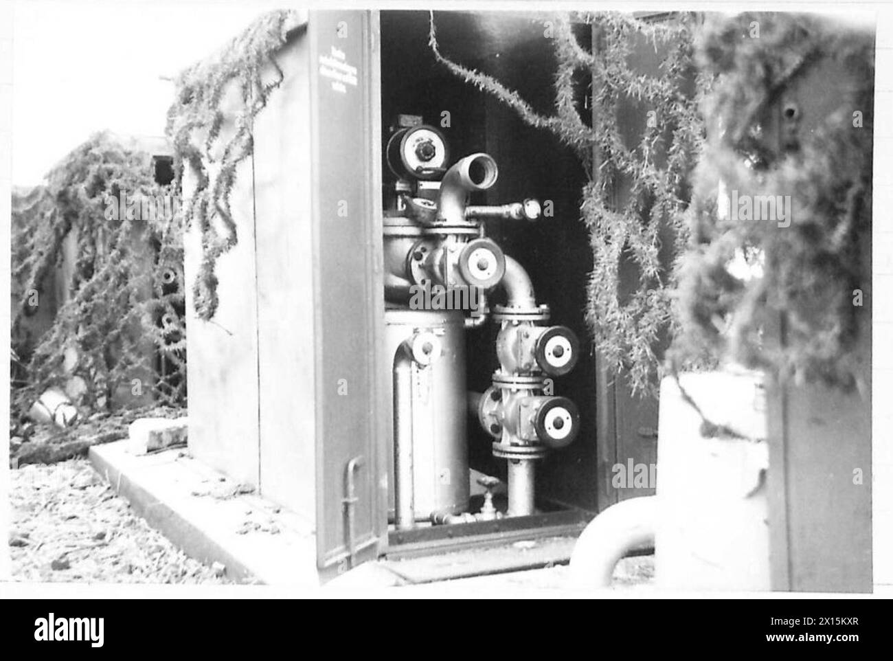A close-up view of the pumping house at a captured German oil refinery ...