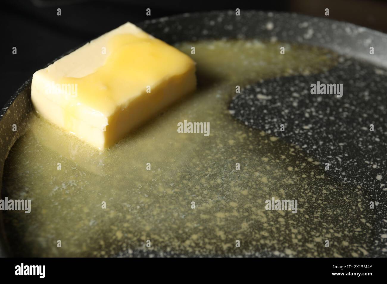 Melting butter in frying pan, closeup view Stock Photo - Alamy