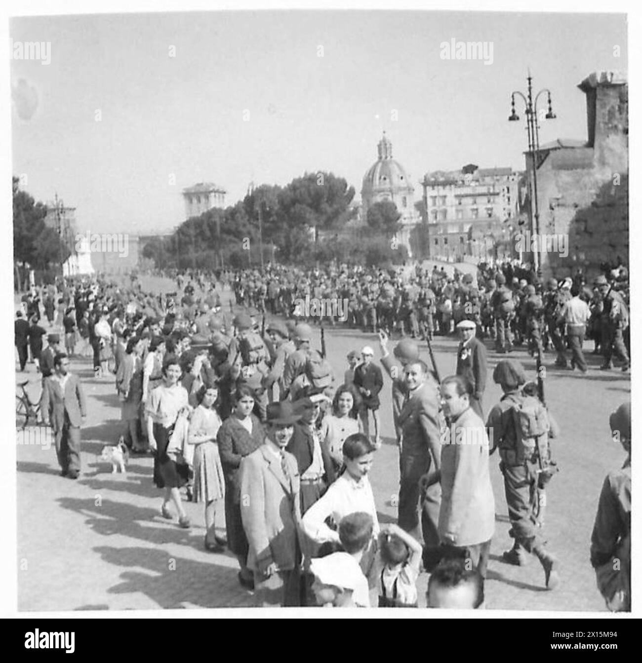 Allied infantry pass through a city in North Africa, Sicily, Italy, the ...