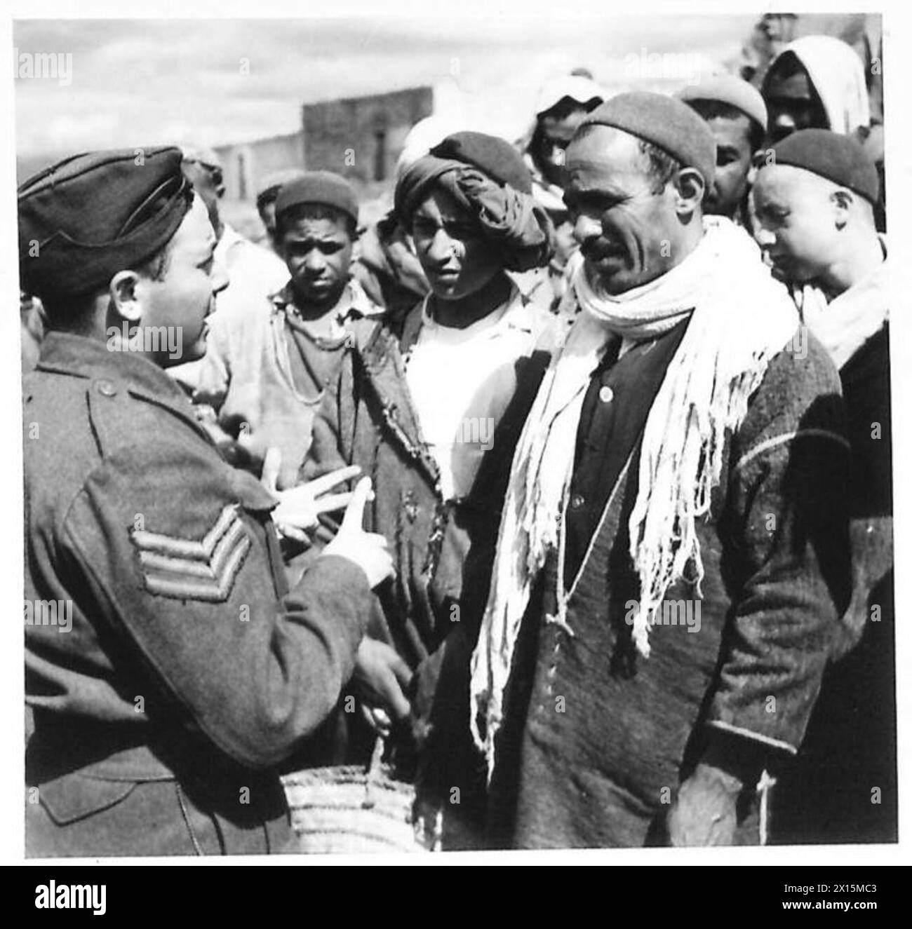 Sgt. Sang briefs a North African village corporal on news points via ...