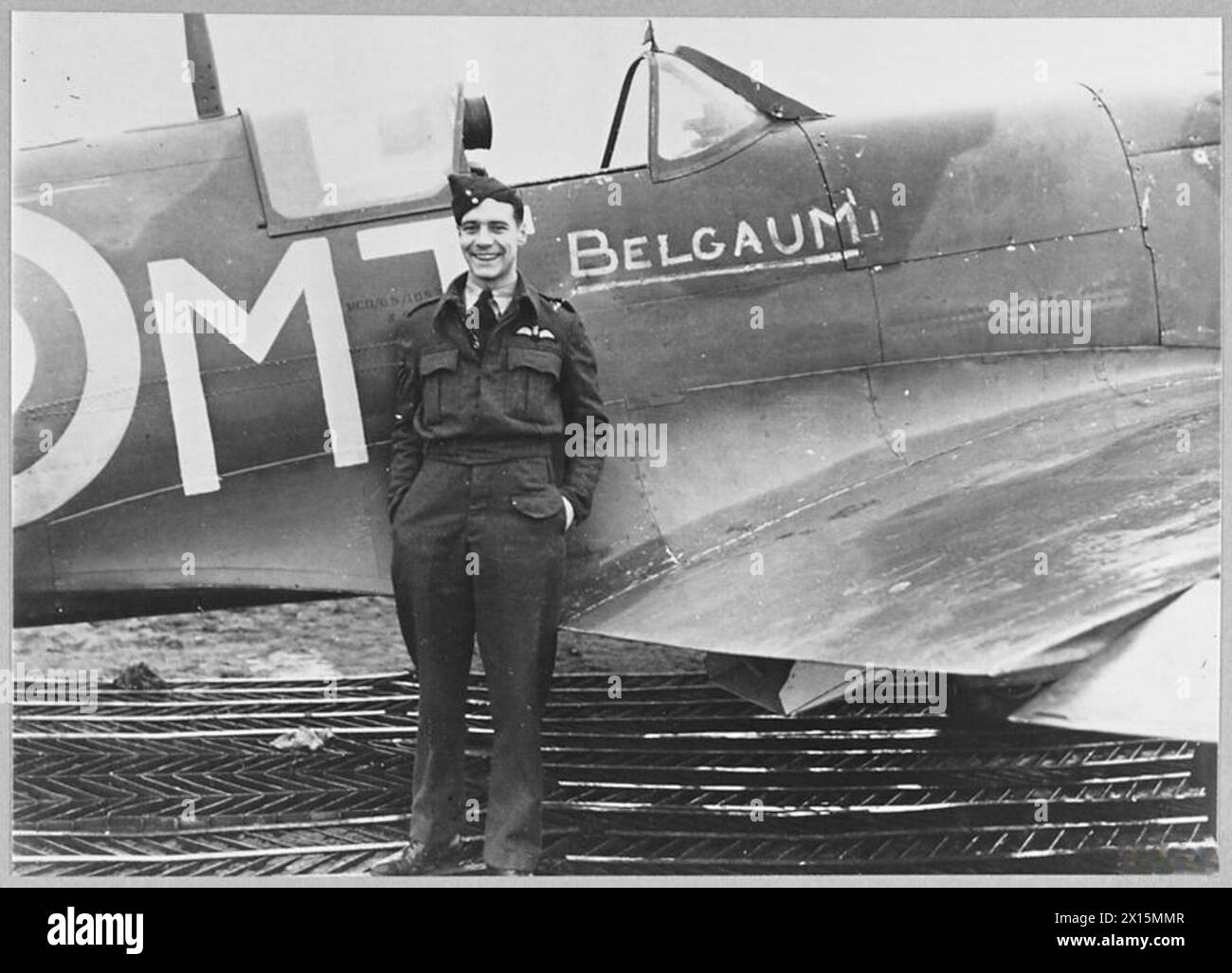 Sergeant R. Harris of London is pictured with the RAF aircraft named ...