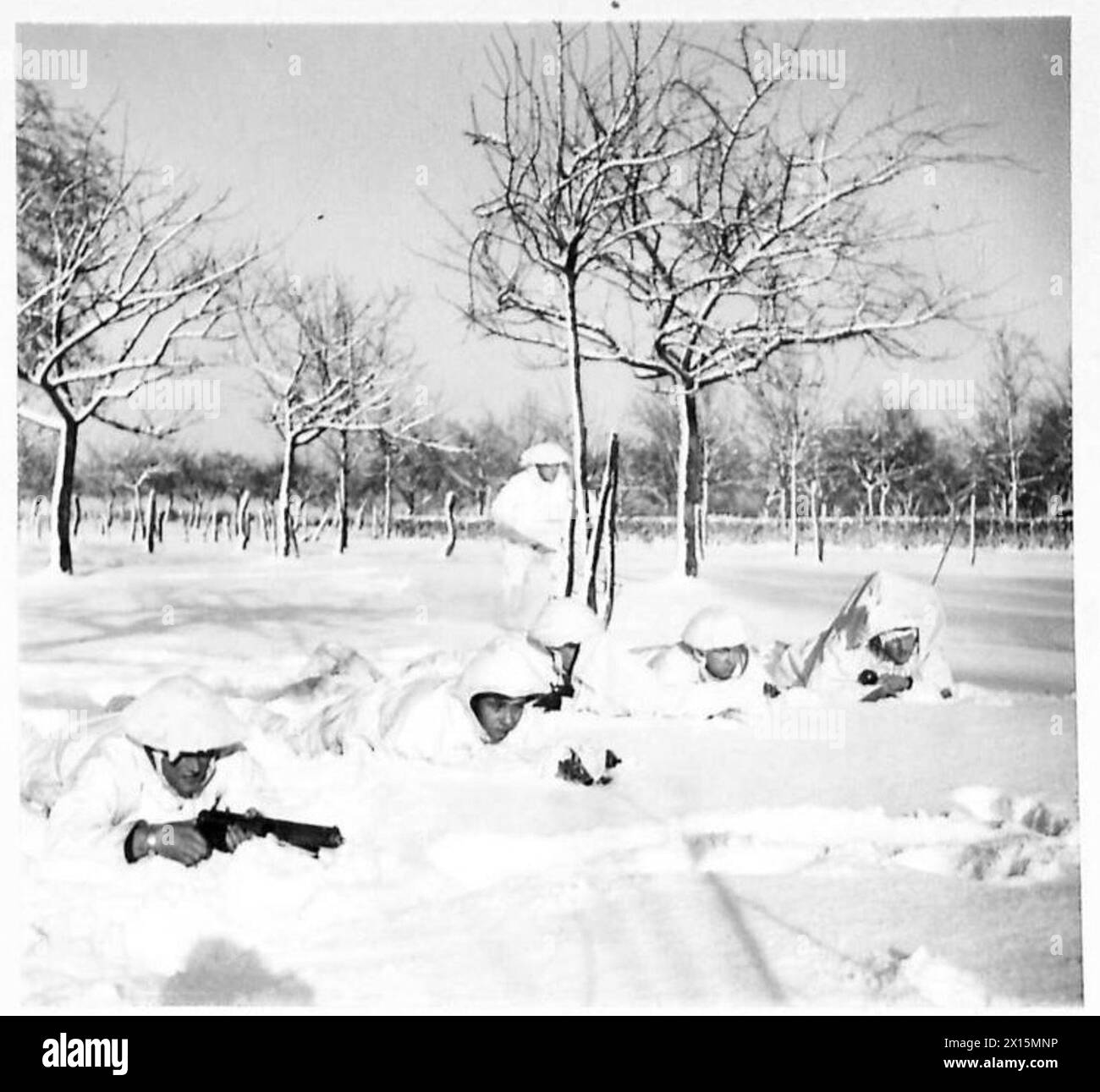 A British patrol moves through snowy terrain, with visibility from ...