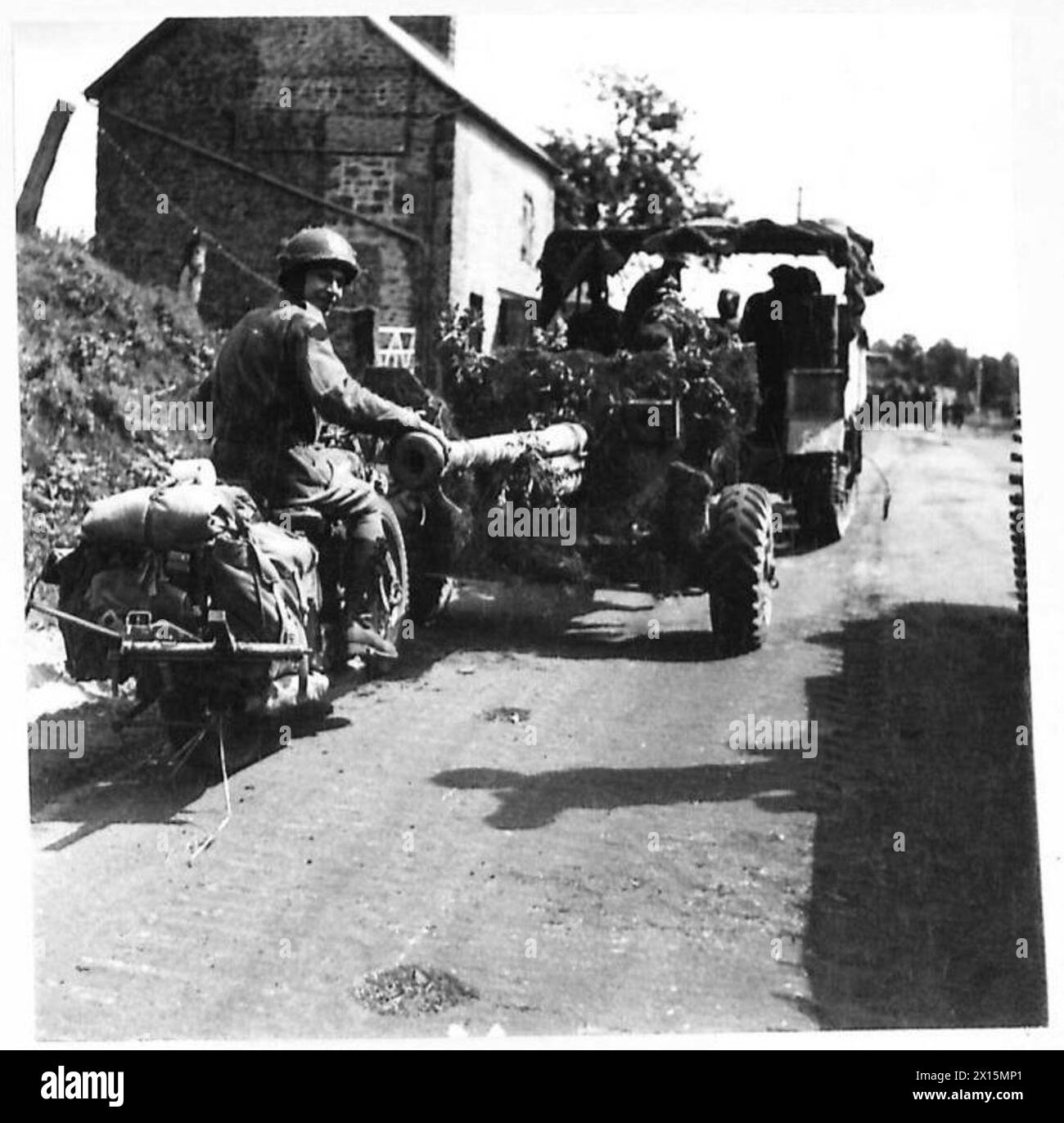 THE ADVANCE THROUGH FLERS - A despatch rider takes a rest on the gun ...