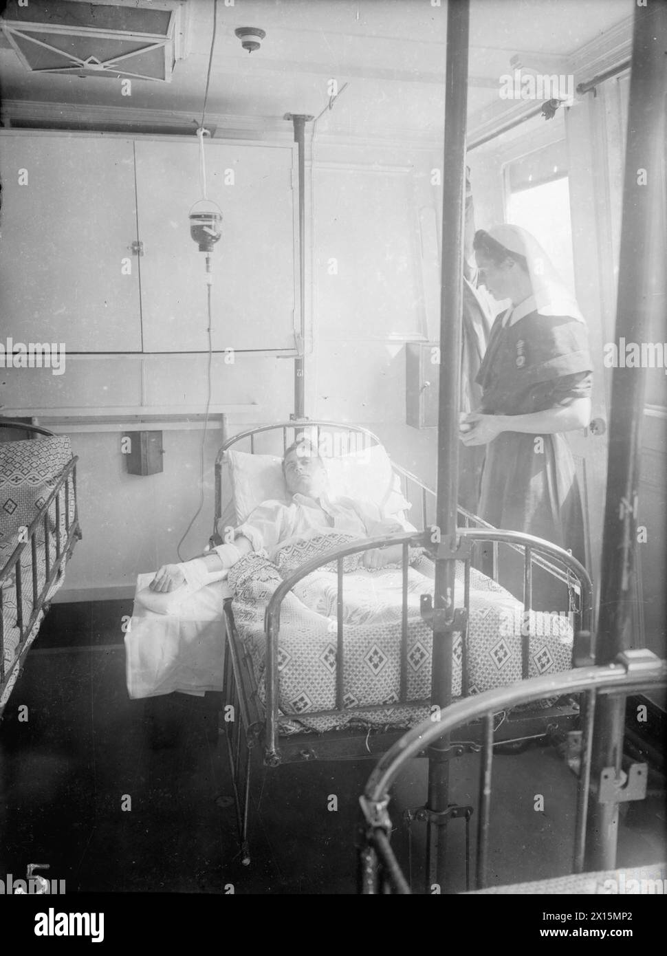 BLOOD TRANSFUSION ABOARD A NAVAL HOSPITAL SHIP. 15 JULY 1943, SCAPA ...