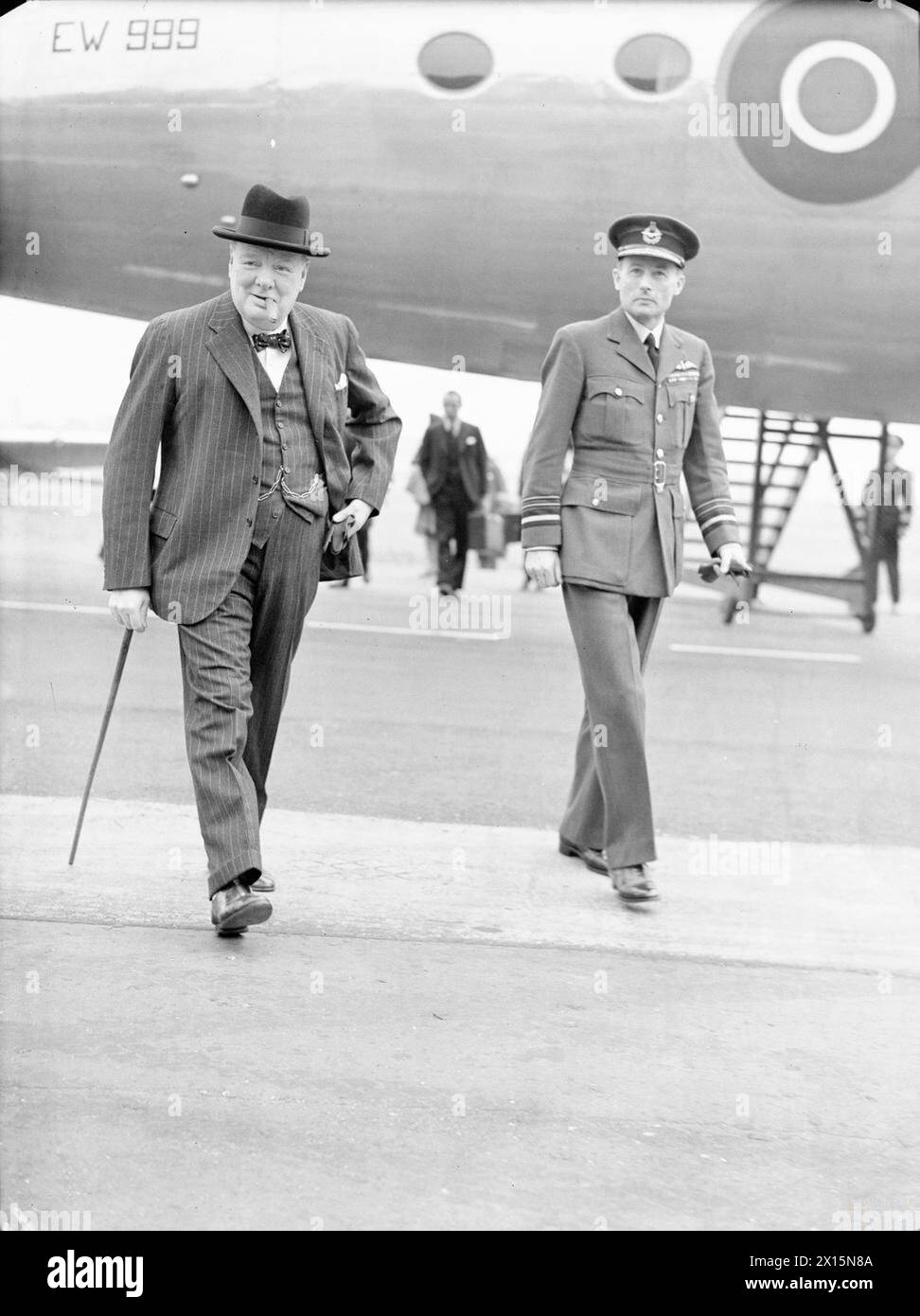Prime Minister Winston Churchill walks from Douglas Skymaster Mark I ...