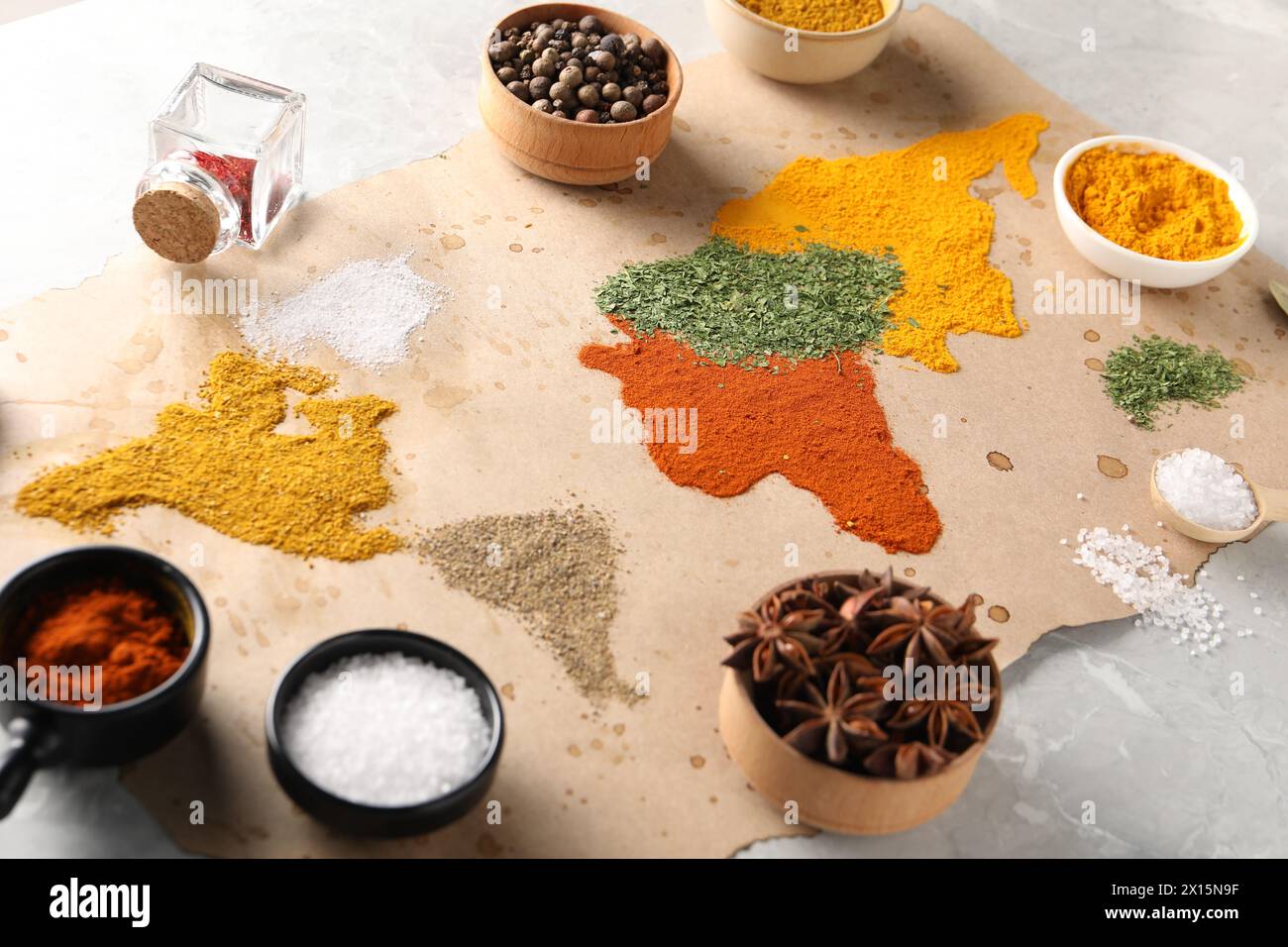 World map of different spices and products on light grey marble table ...