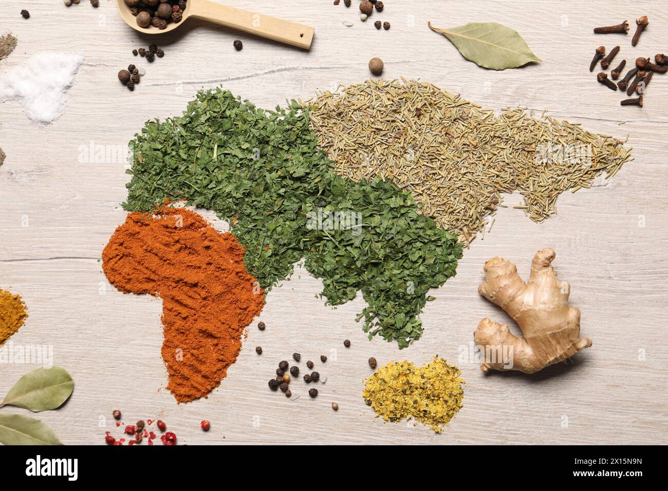 Continents of different spices and products on wooden table, flat lay ...