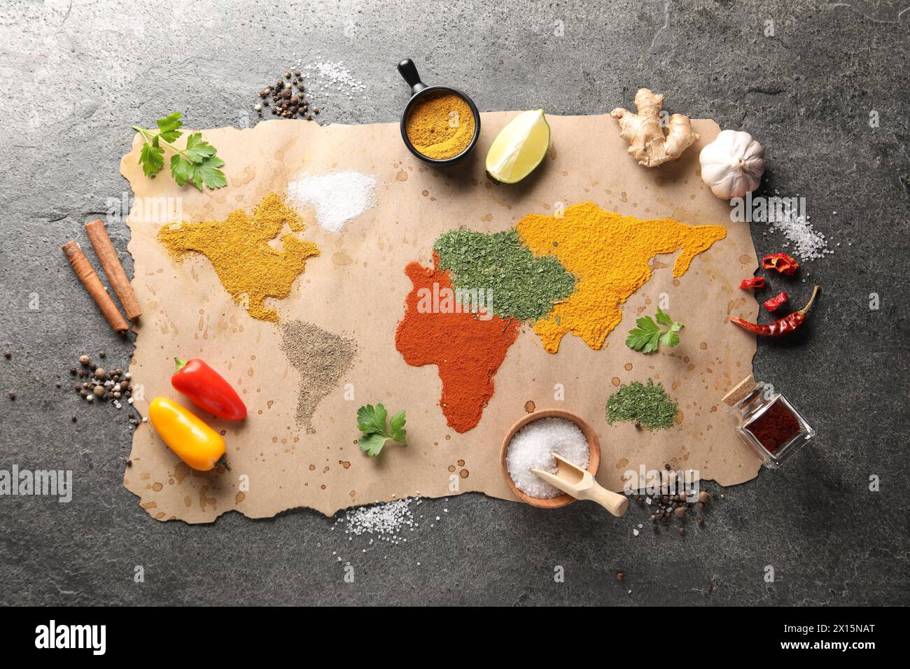 World map of different spices and products on grey table, top view ...