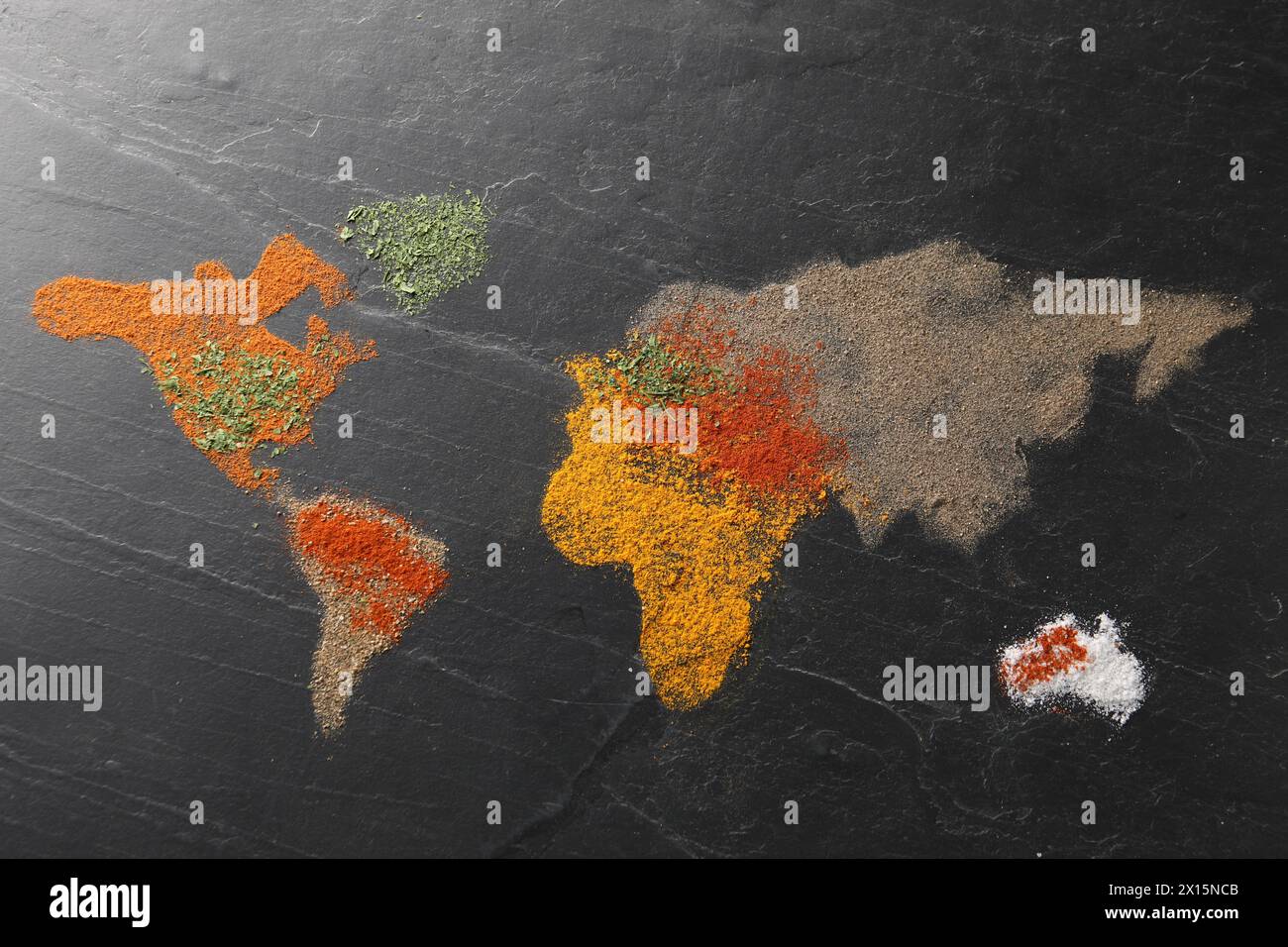 World map of different spices on dark textured table, flat lay Stock ...