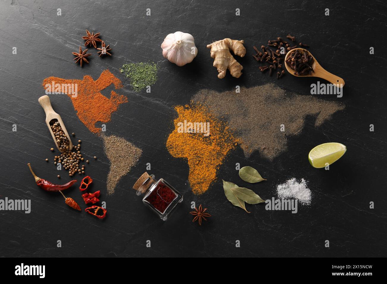 World map of different spices and products on dark textured table, flat ...