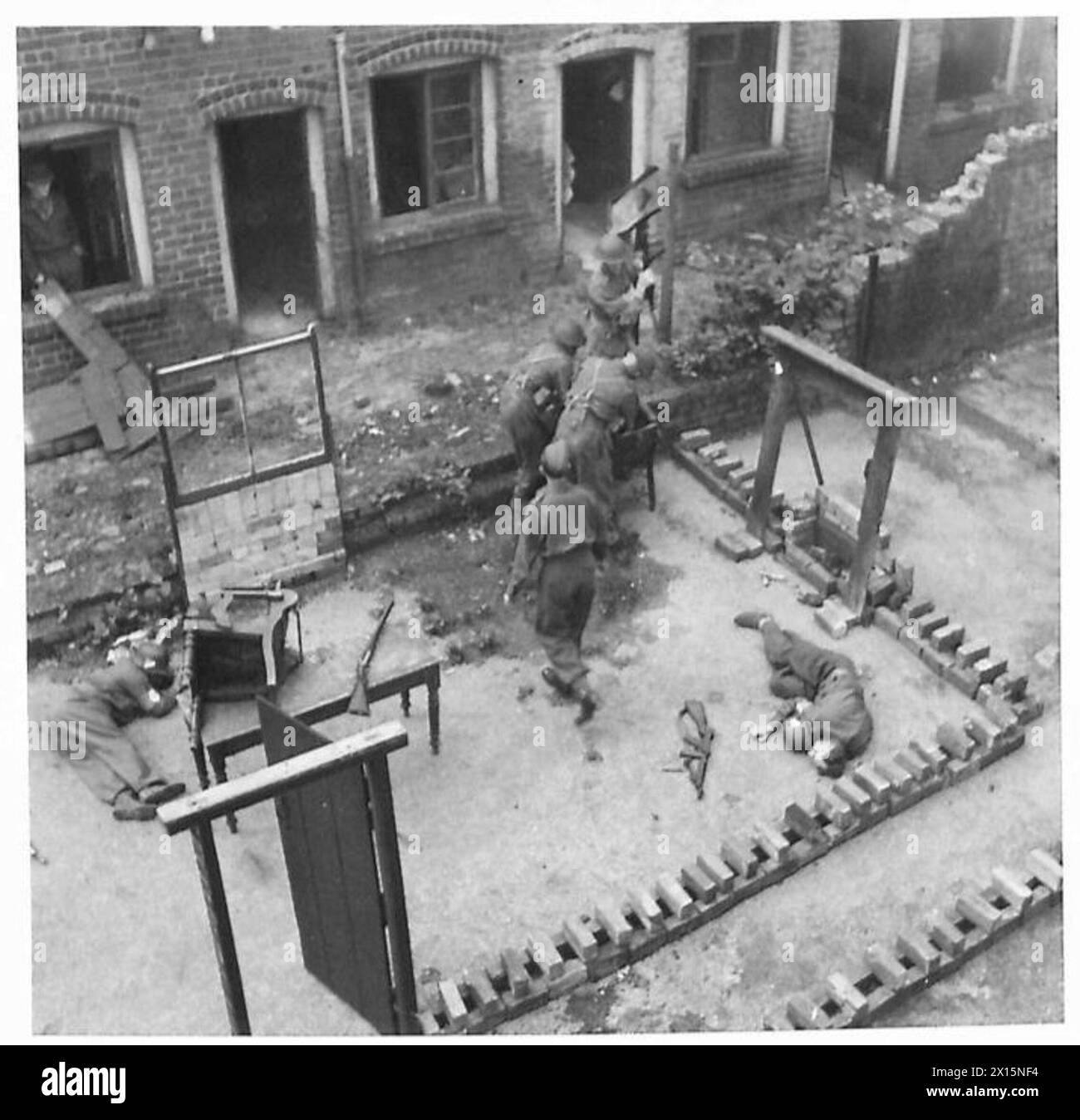 A rifle group lifts their Commander through a hole in a ceiling during ...