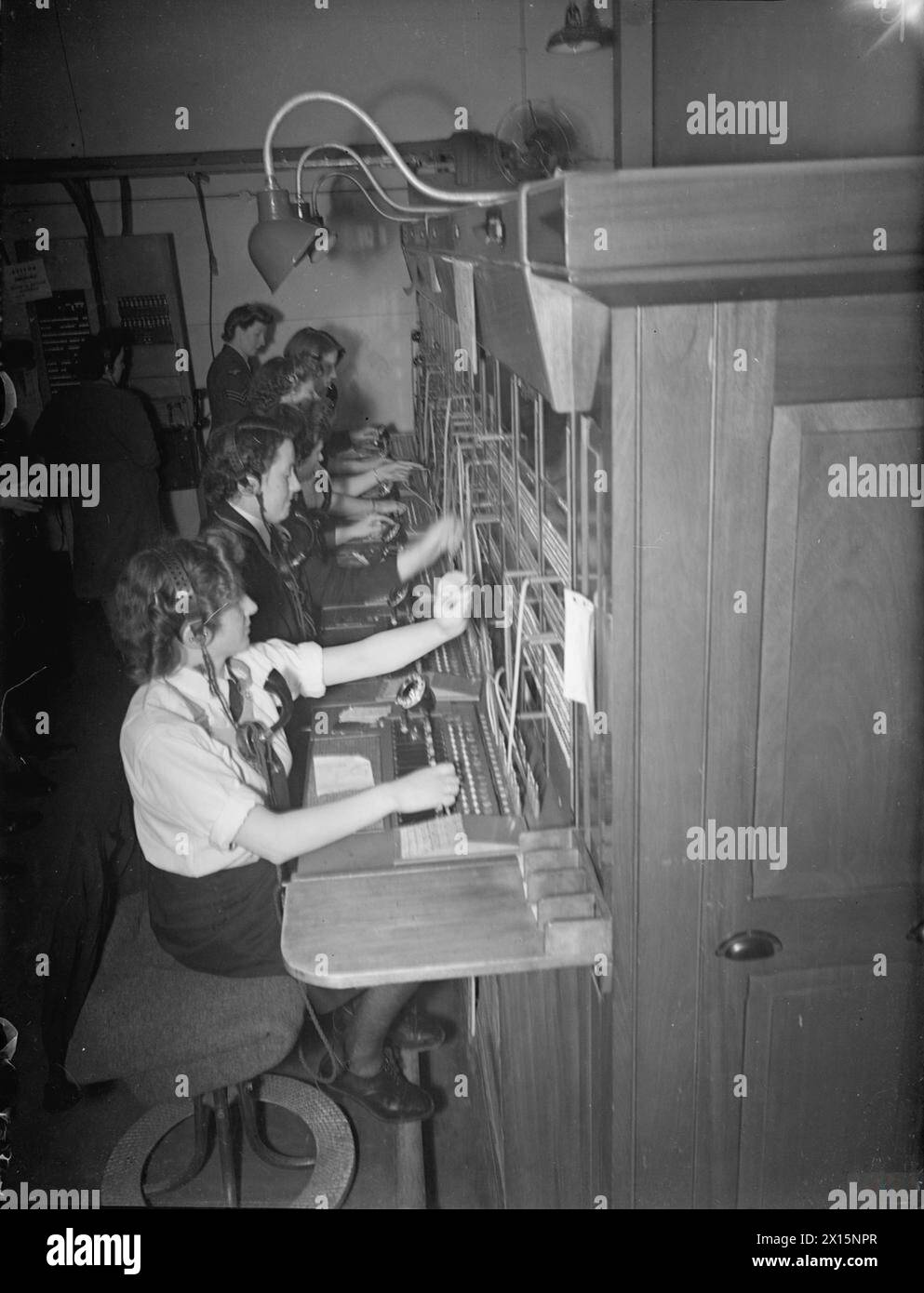 On 20 May 1944 at Rosyth, Wren operators work in a naval operational ...