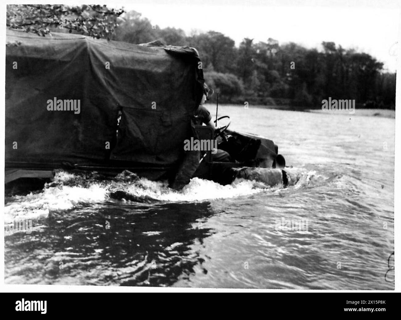 An anti-tank gun tractor crosses a river as part of a British Army ...