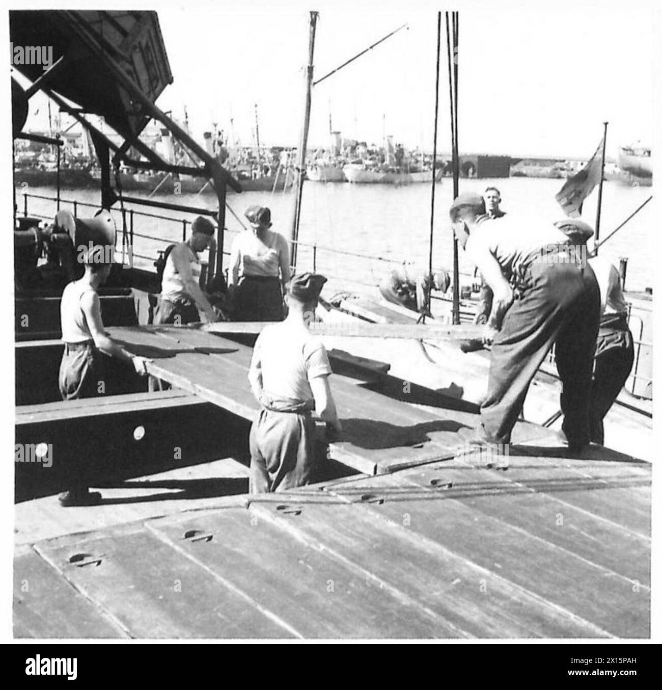 Royal Engineers open hatches on a ship in an African-bound convoy for ...