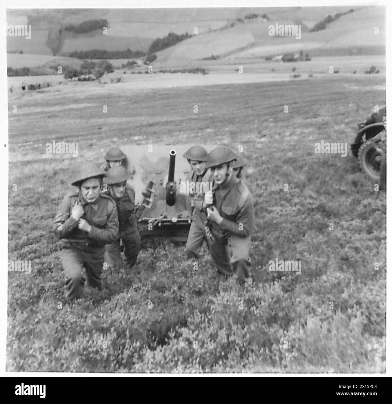 British Army soldiers hauling a 2-pounder Mark III anti-tank gun up a ...