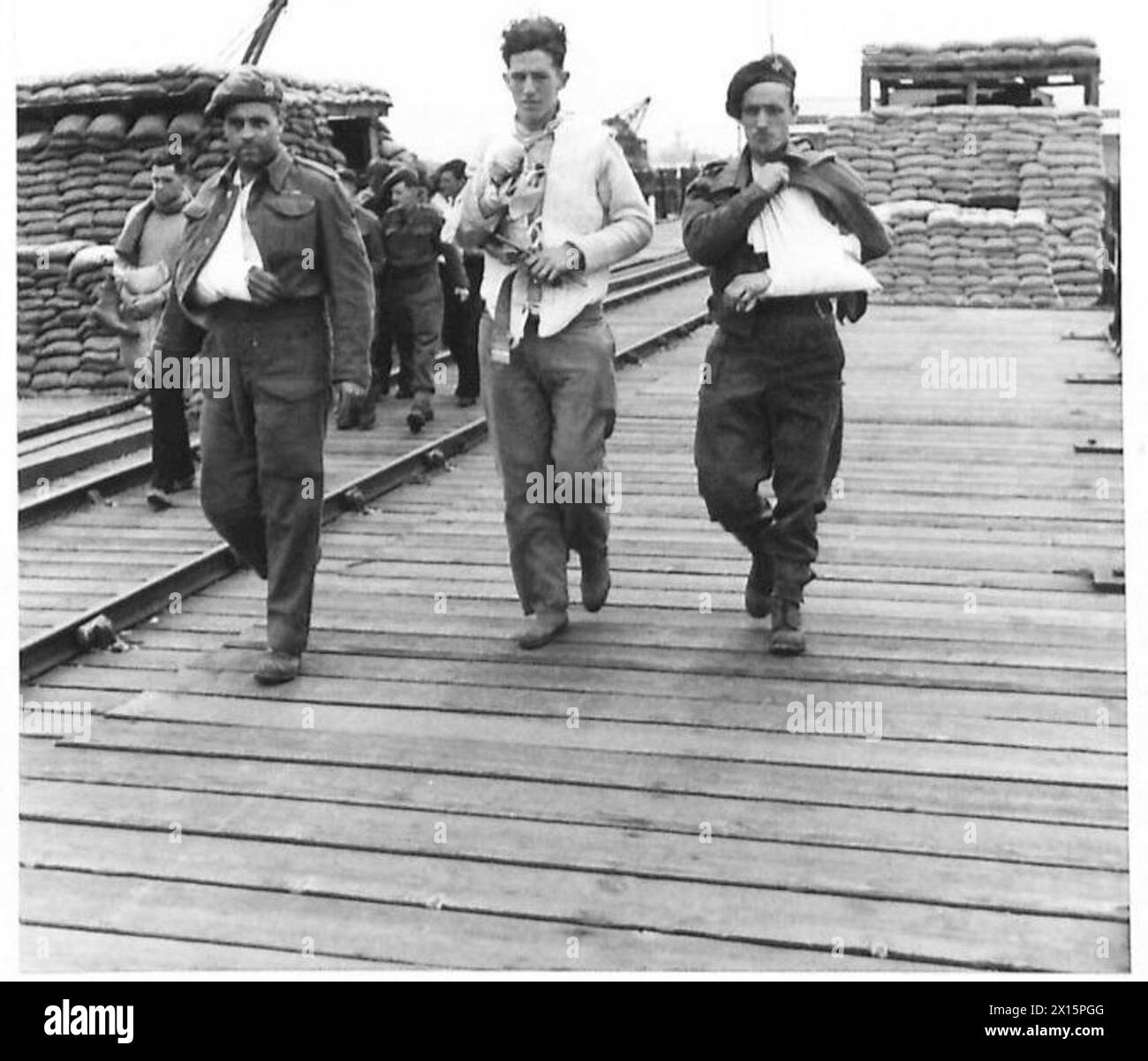 WOUNDED ARRIVE BACK IN ENGLAND - Wounded walking along the pier to ...