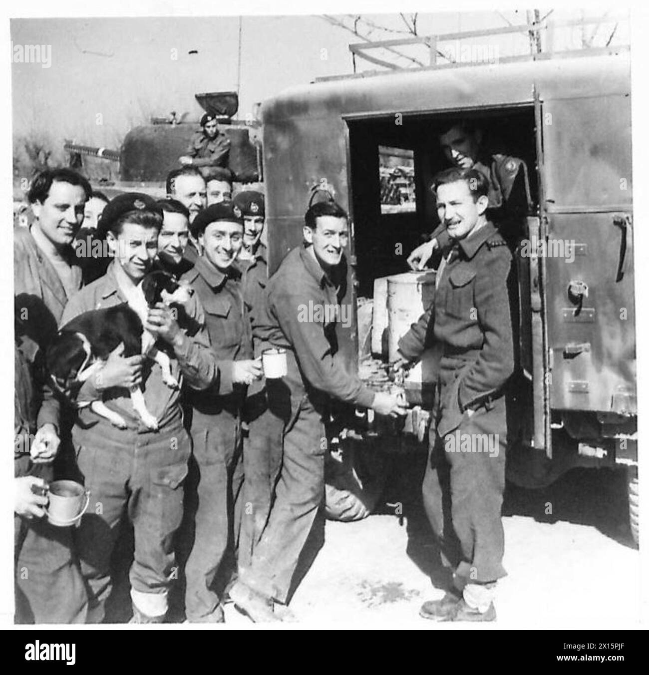 Allan Gallagher of 'Toe H' is serving tea to Trooper Harold Collins ...