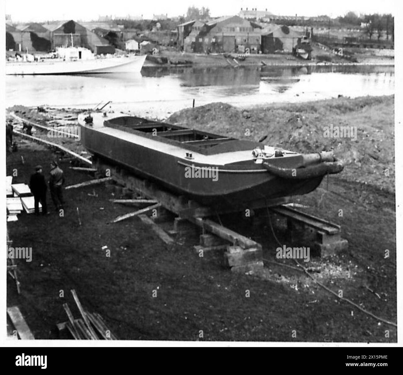 ROYAL ENGINEERS ASSEMBLE NEW CRAFT - 60 ft. dumb barge looking along ...
