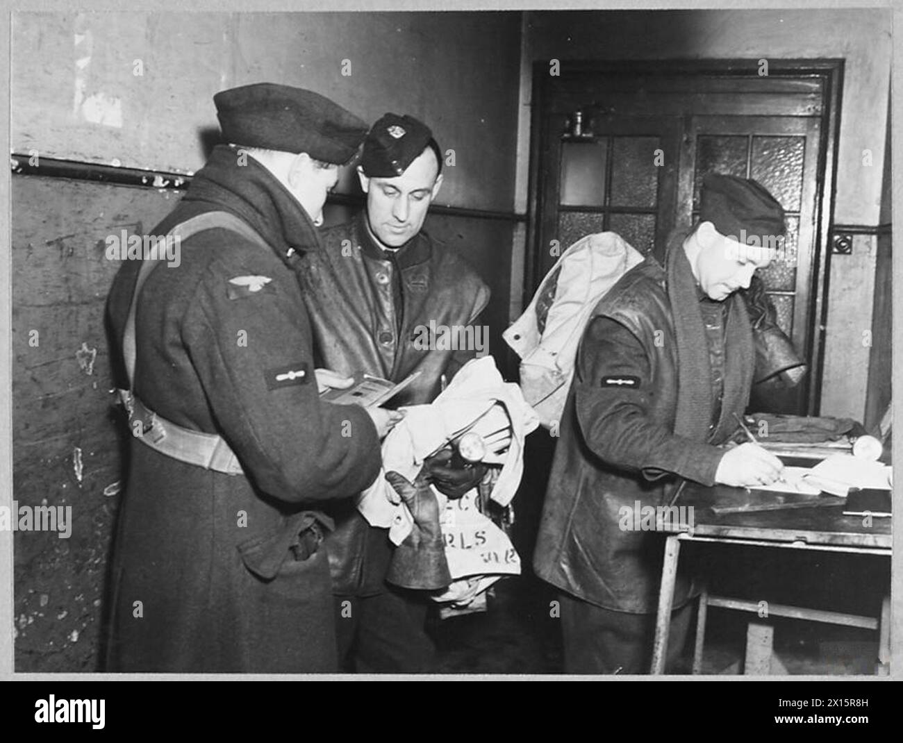In 1944, two D.R.L.S. drivers are shown entering RAF headquarters. LAC ...