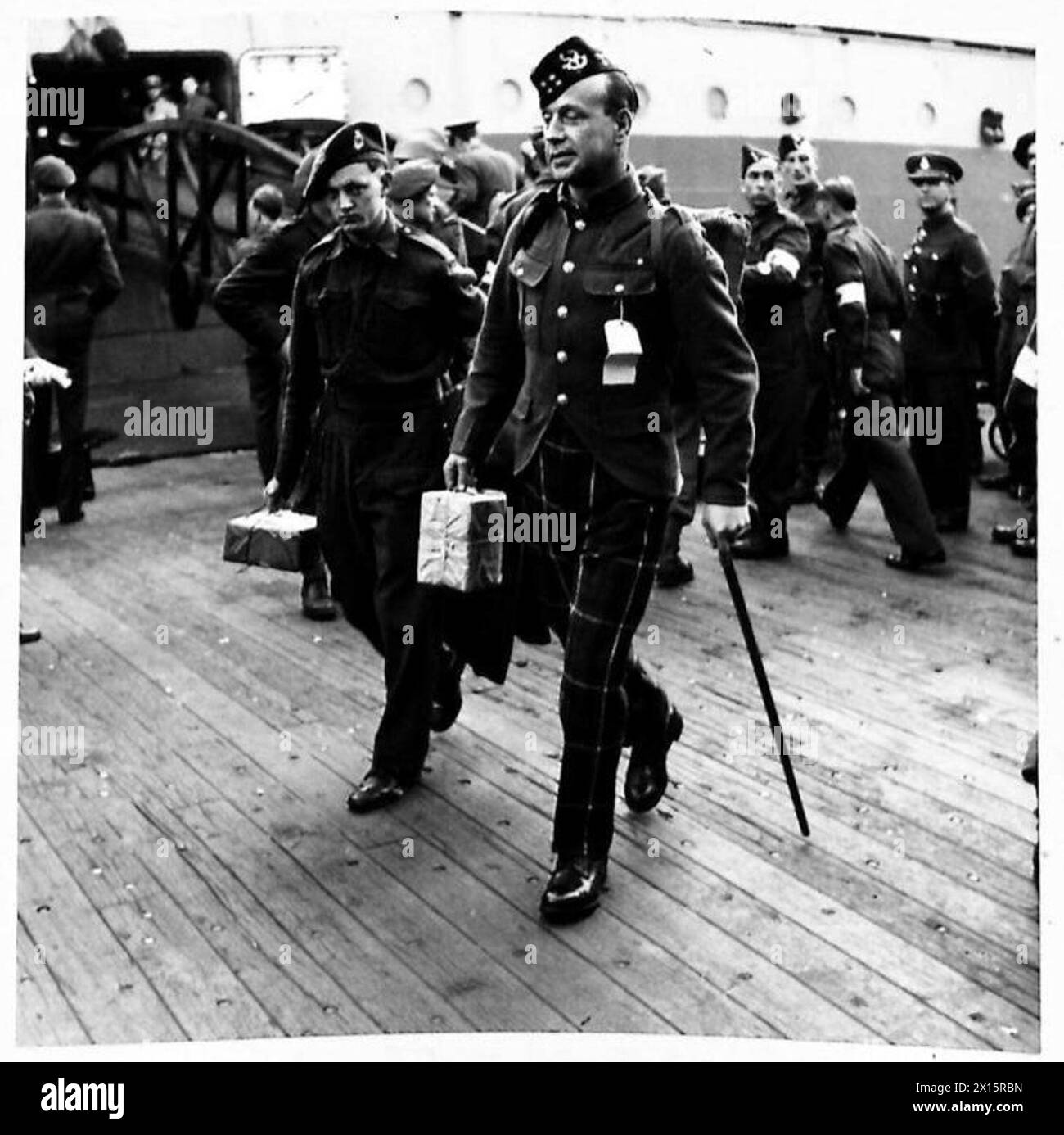 Repatriated prisoners of war are seen coming ashore from a liner during ...
