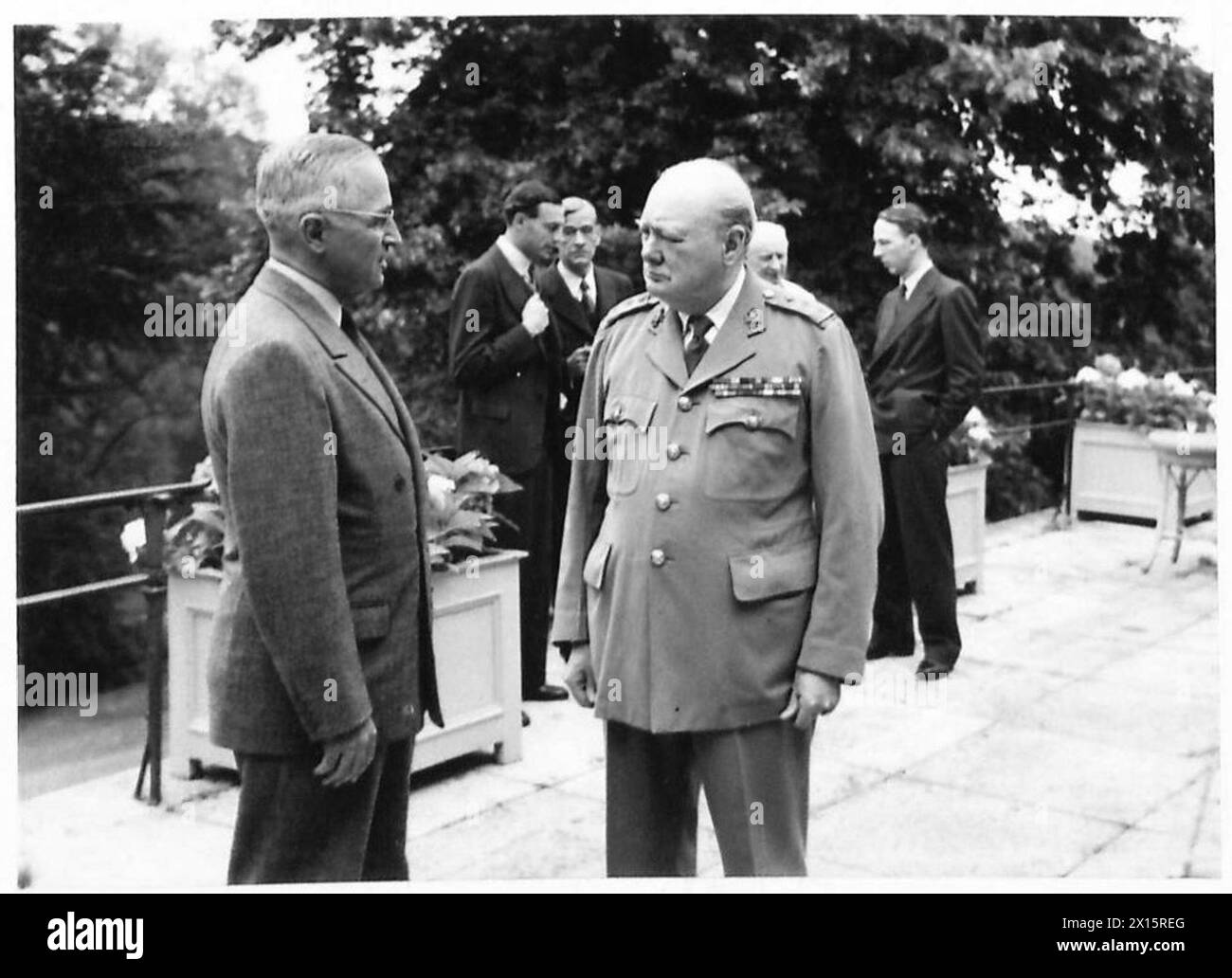 The Prime Minister and President Truman are seen talking together in ...