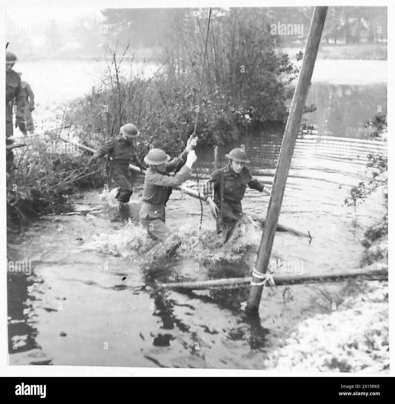 SCHOOL OF BATTLE DRILL - More troops using the rope swing to cross a ...